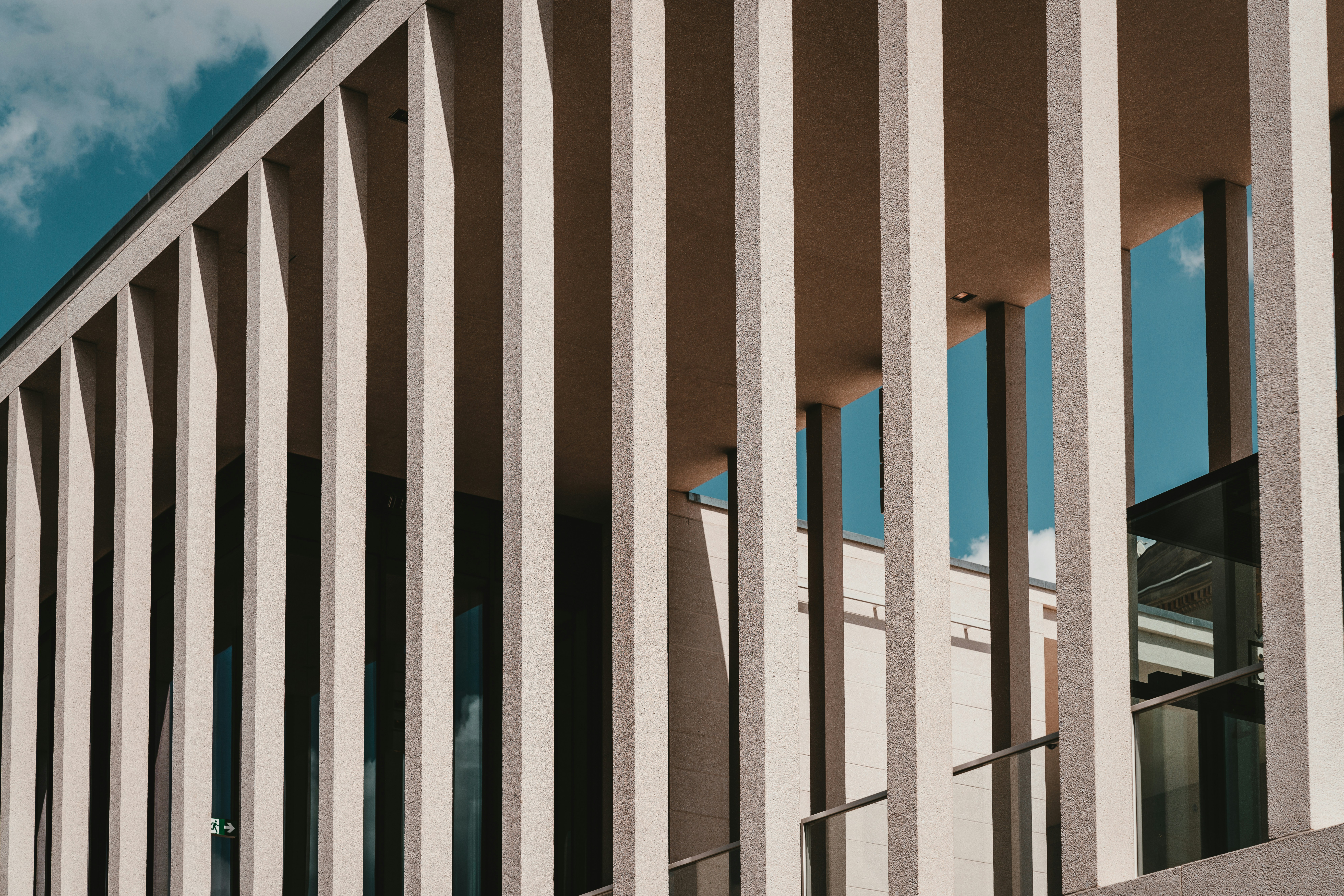 A building that has a bunch of windows on it photo – Free Abstract ...