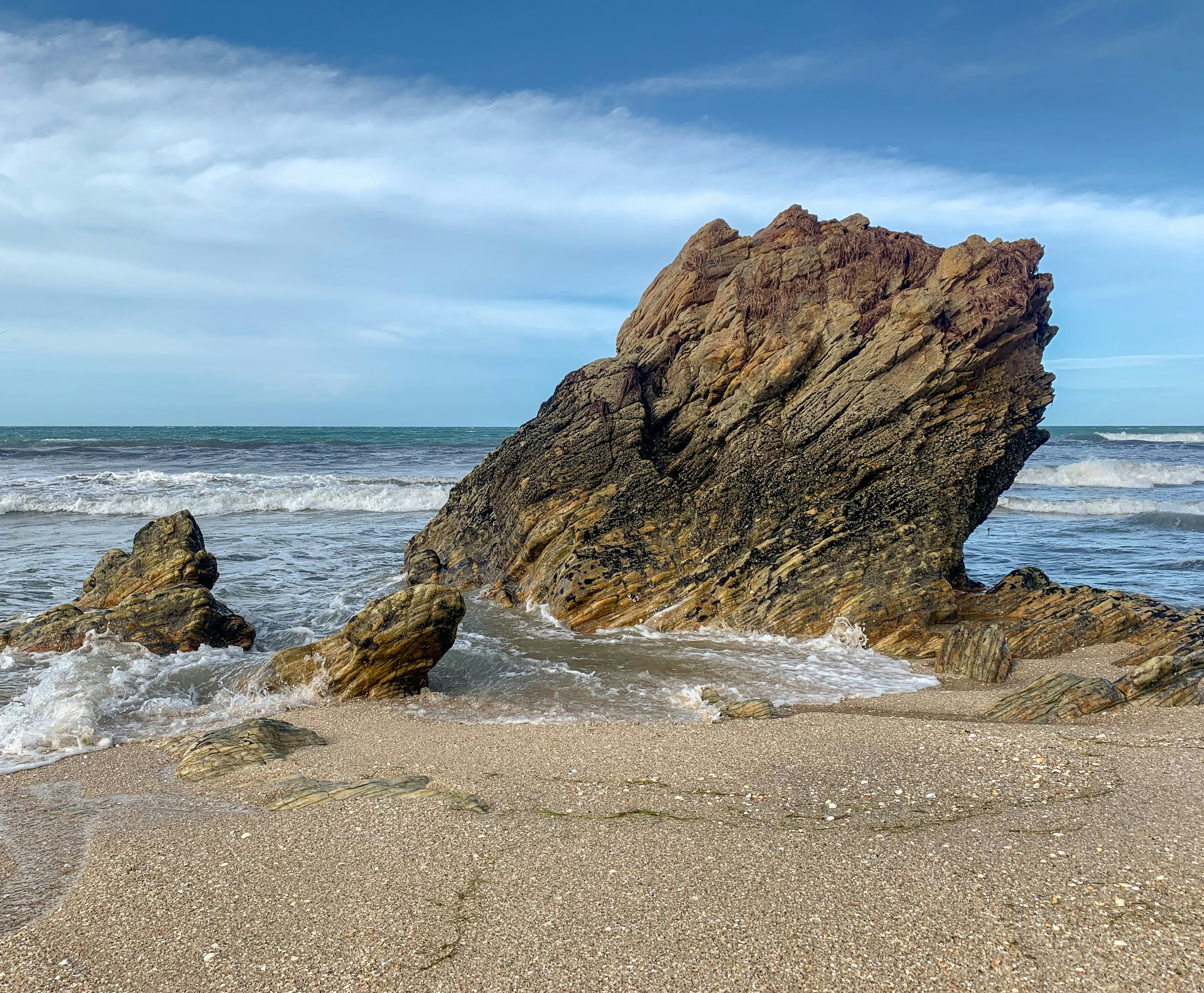 Sea-Roost: A Weathered Sill Crowned by a Jagged Rock