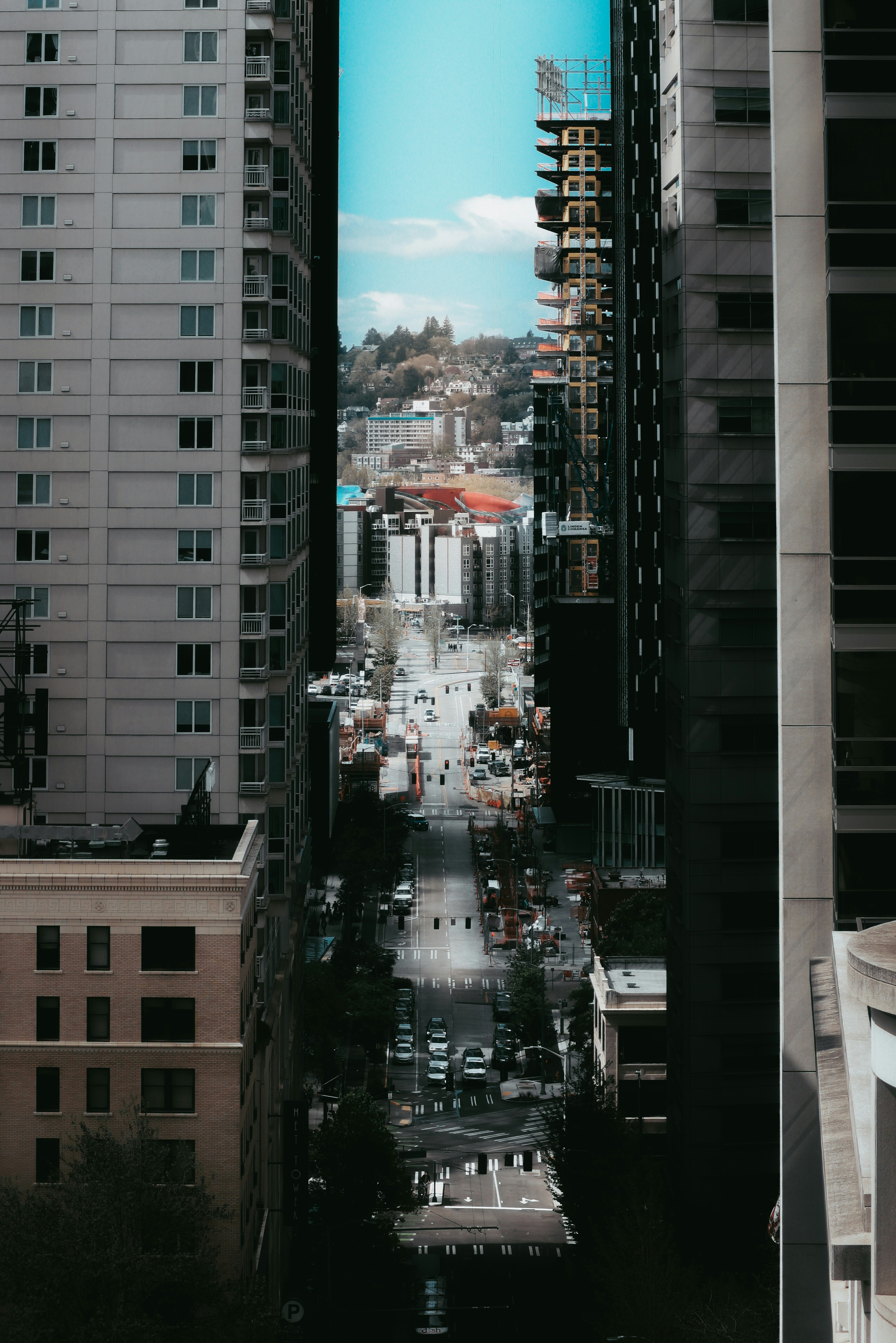 Aerial view of streets between high rise buildings photo – Free ...