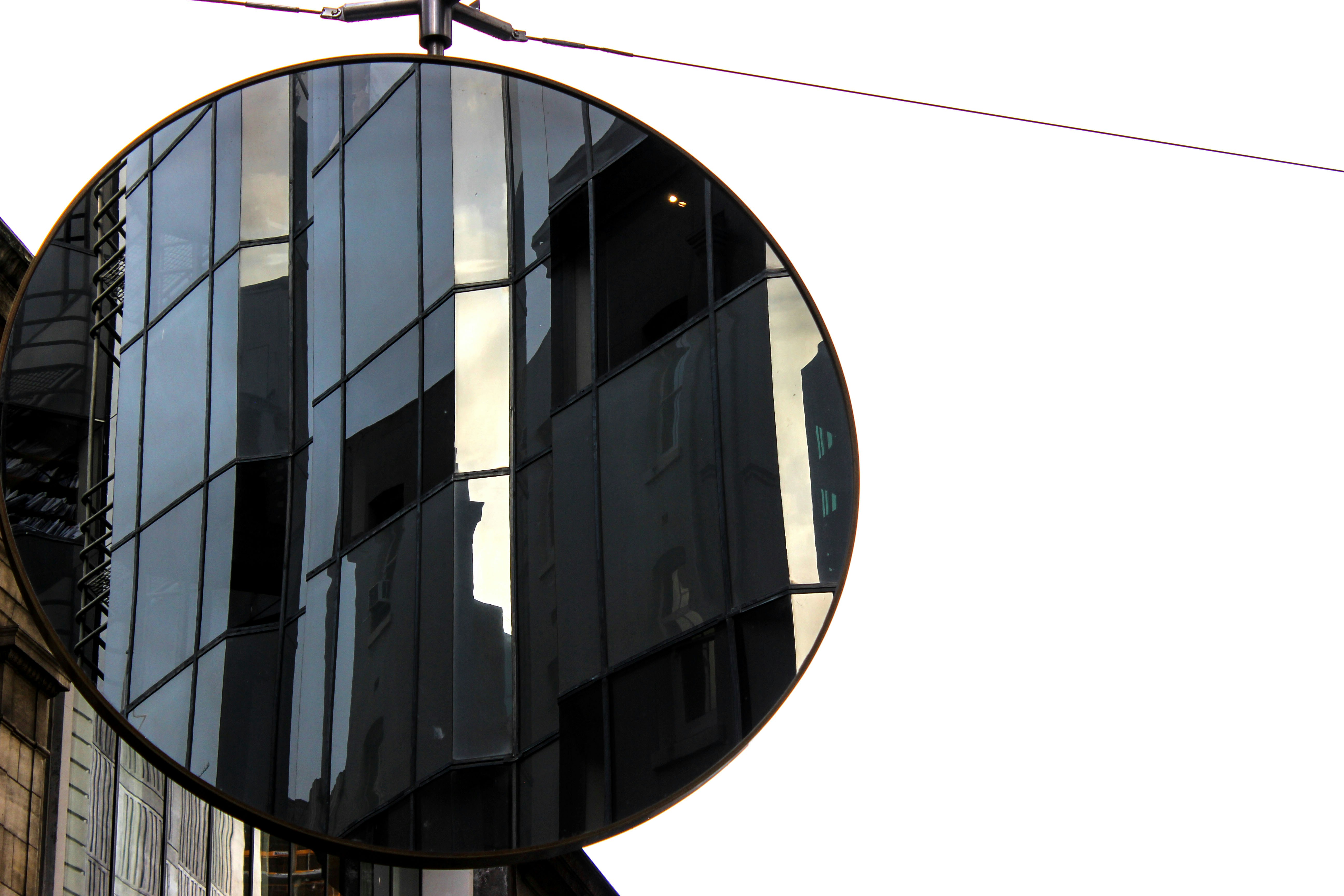 Reflections in a Circular Window: Urban Facade Framed
