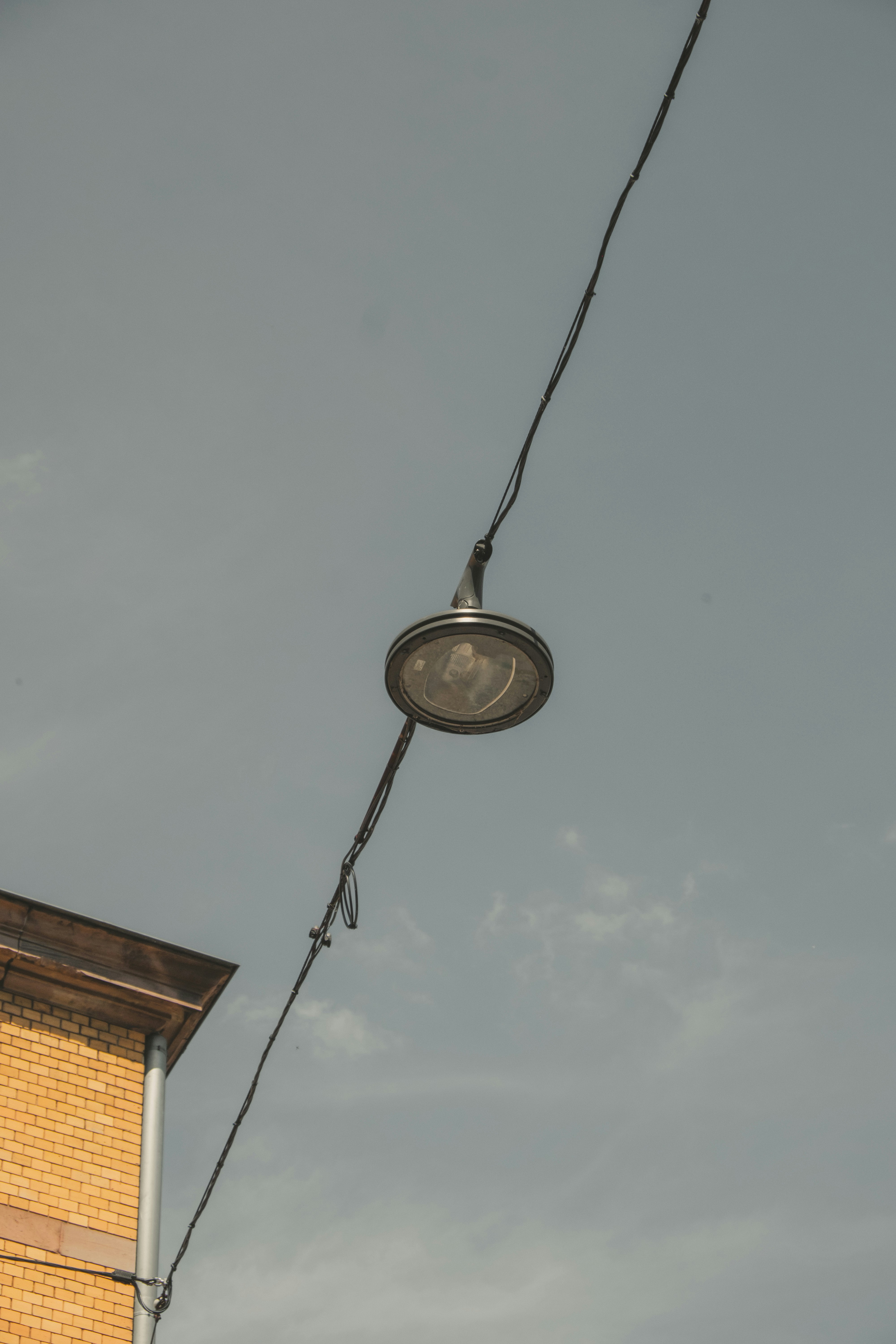 Diagonal Lantern: Streetlight Tracing a Wire Across a Quiet Sky