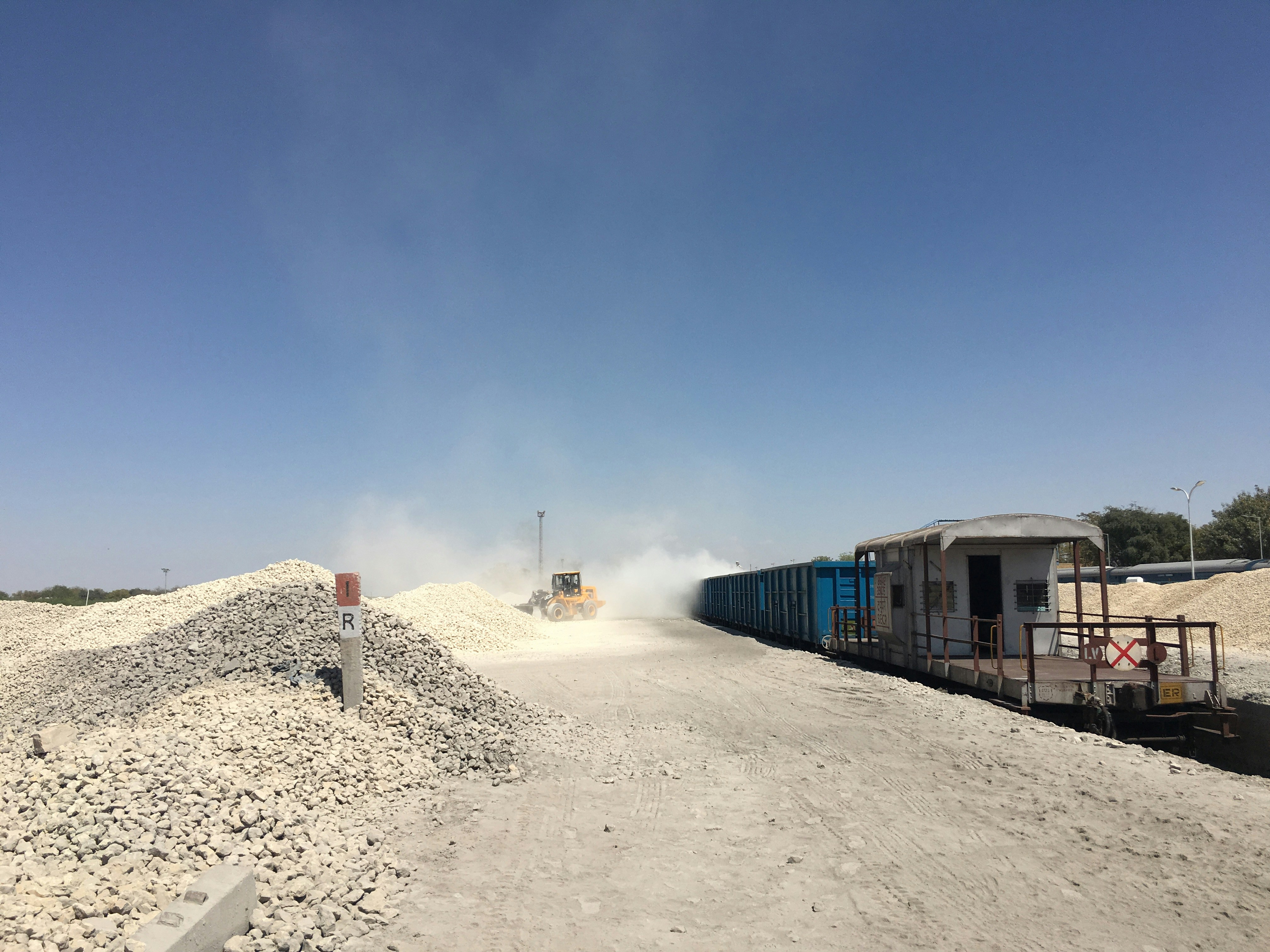 Dust, Rails, and Rock: A Distant Quarry in Motion