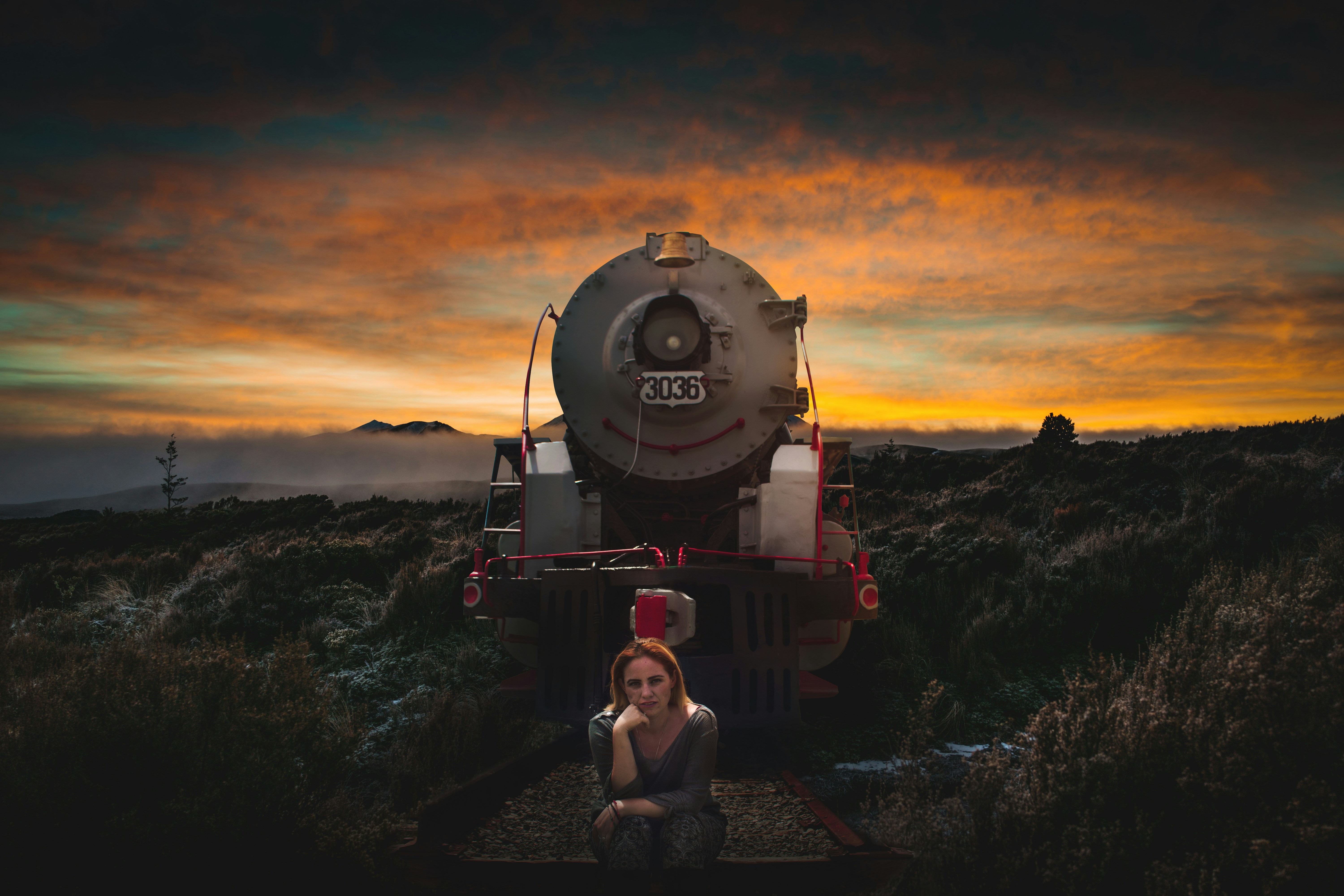Woman in front of a train photo – Free Land Image on Unsplash