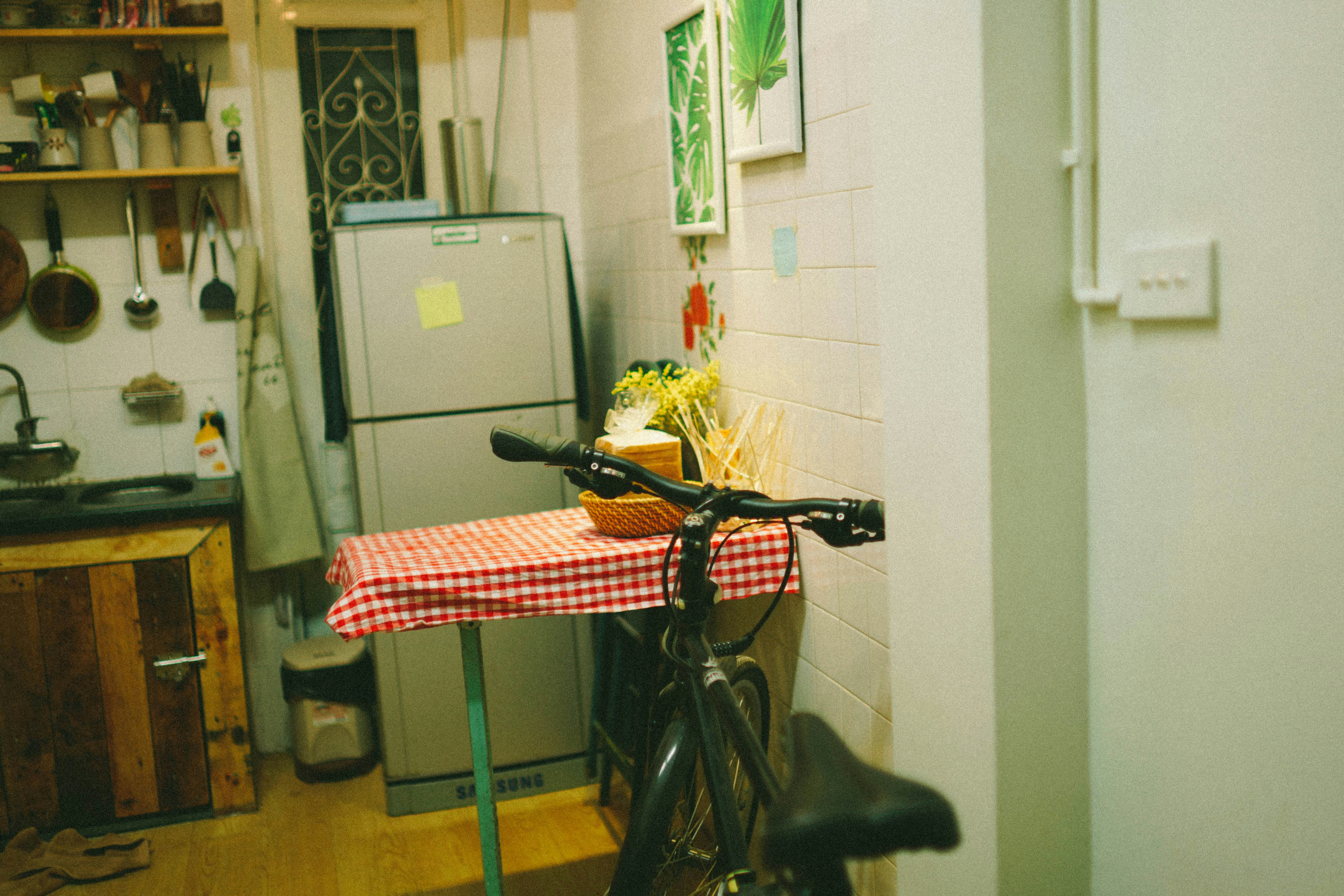 Bicycle by a Pepper-checked Table in a Cozy Kitchen Corner
