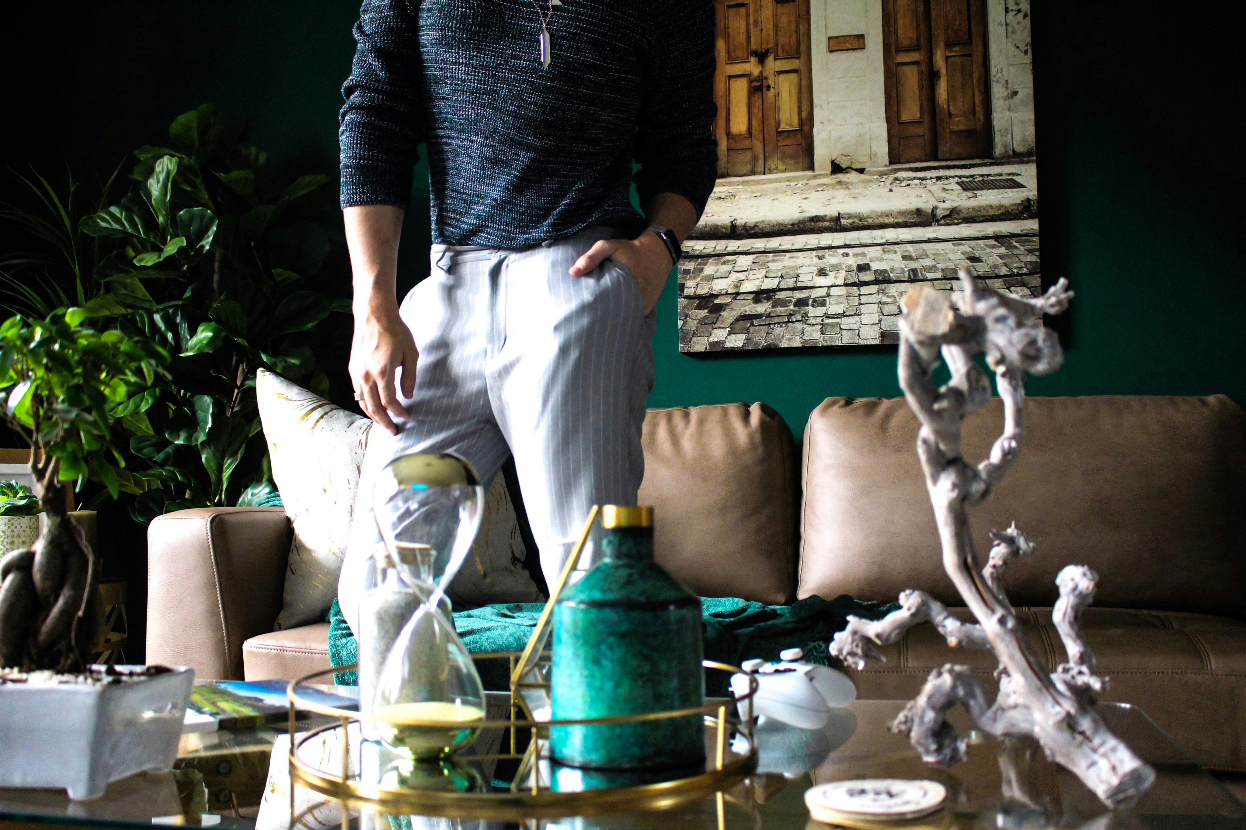 Understated Confidence: A Casual Pose in a Green Living Room