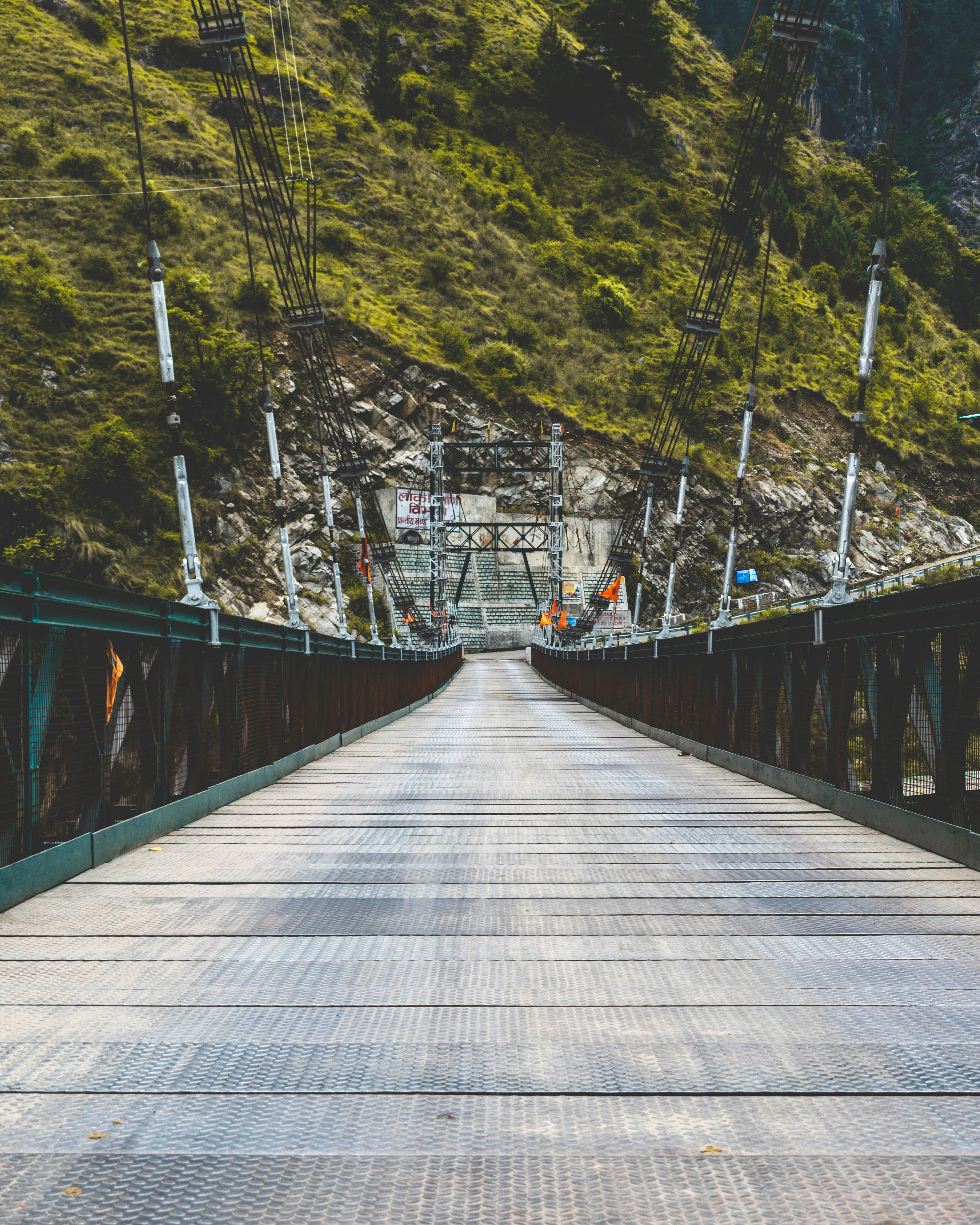 A long bridge with a mountain in the background photo – Free Bridge ...