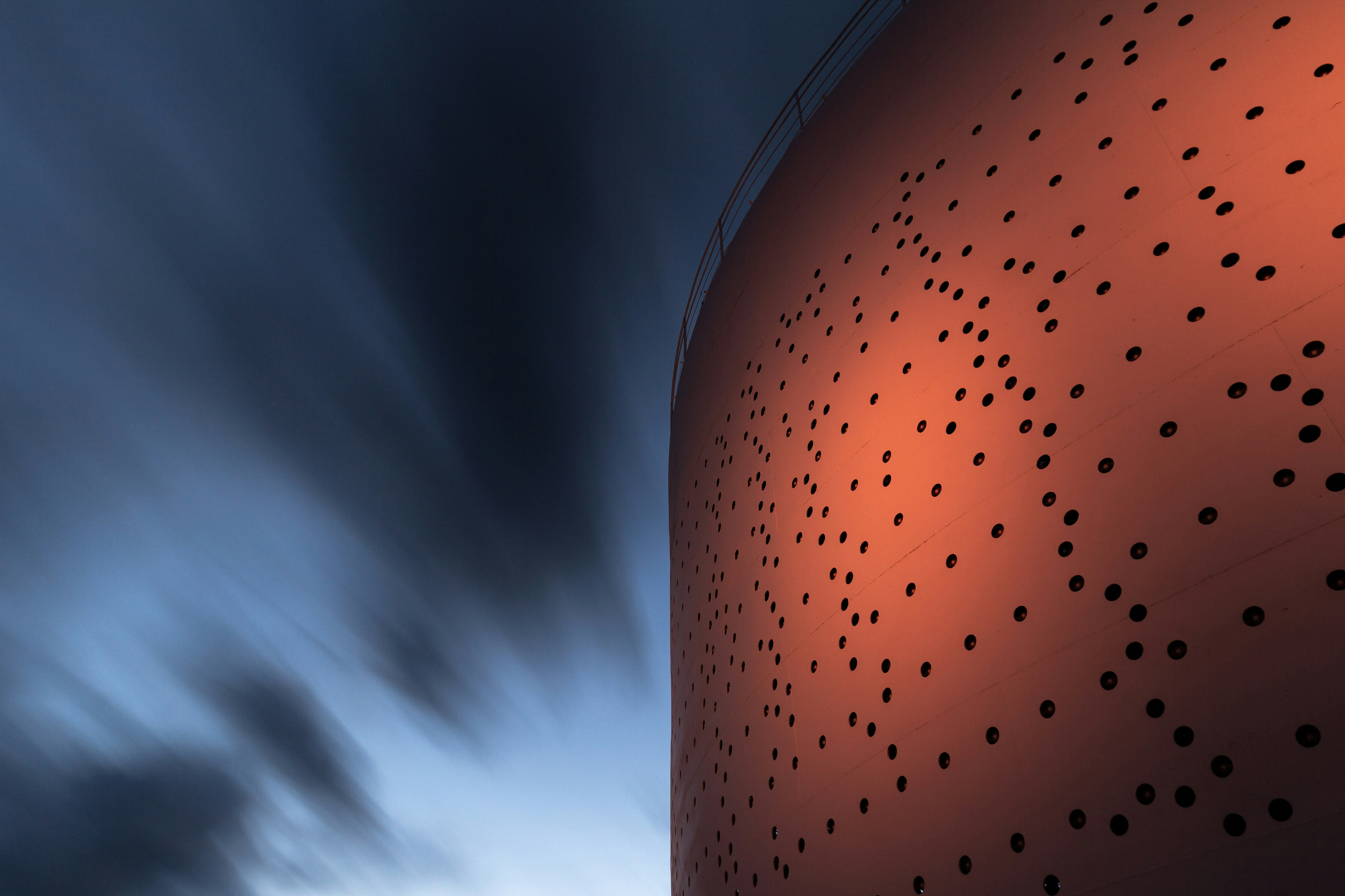 Oil Silo 468 in Helsinki, also known as 'Shining Beacon of Light', has been turned into a light artwork. A total of 2012 openings were cut into the shell of the silo and fitted with mirrors that reflect the sun. As night falls, LED lights turn the silo into a continuously changing light artwork. This shot was taken with a long 2-minute exposure.