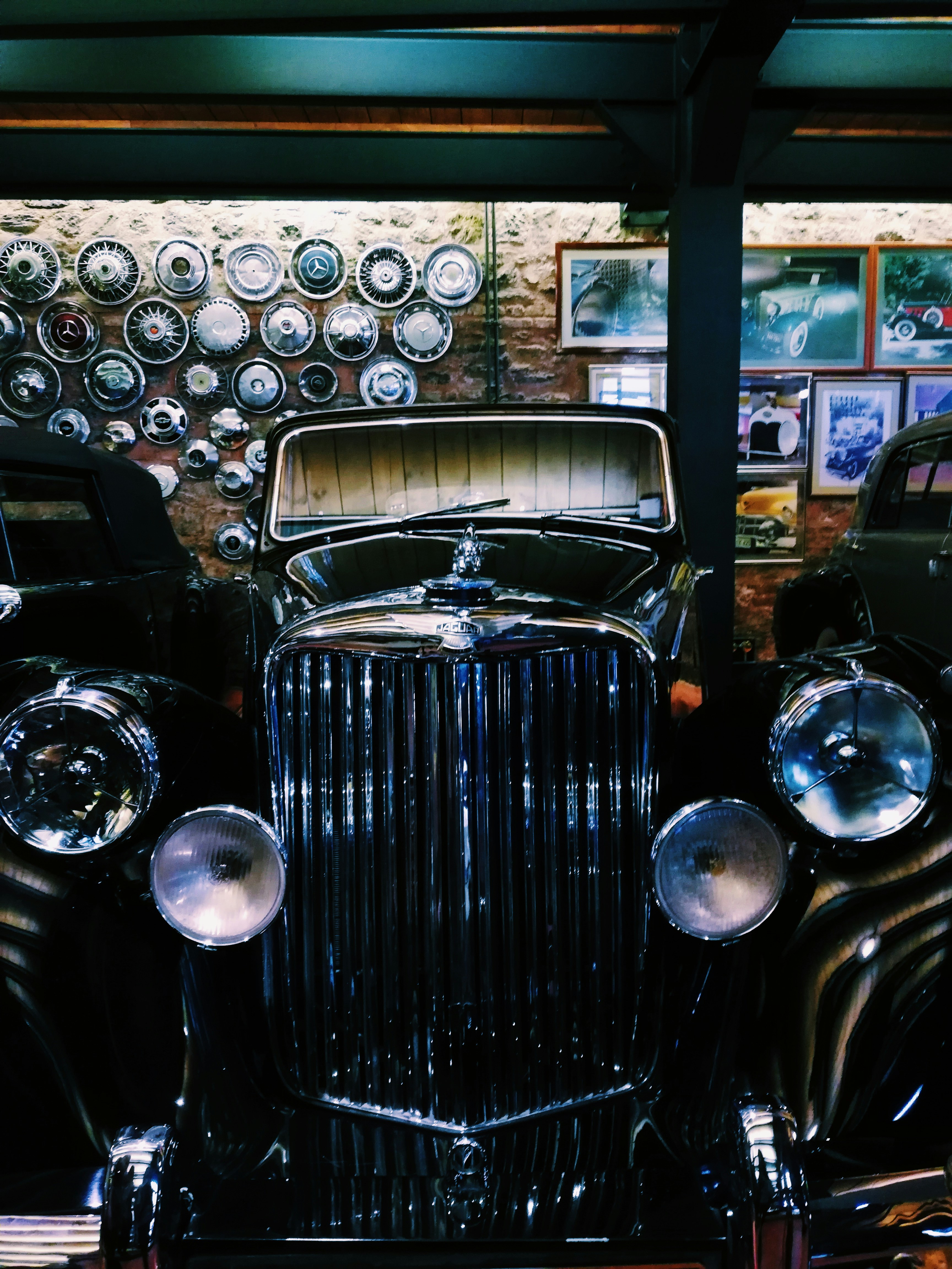 Chrome Nostalgia: Front View of a Classic Car in a Vintage Gallery