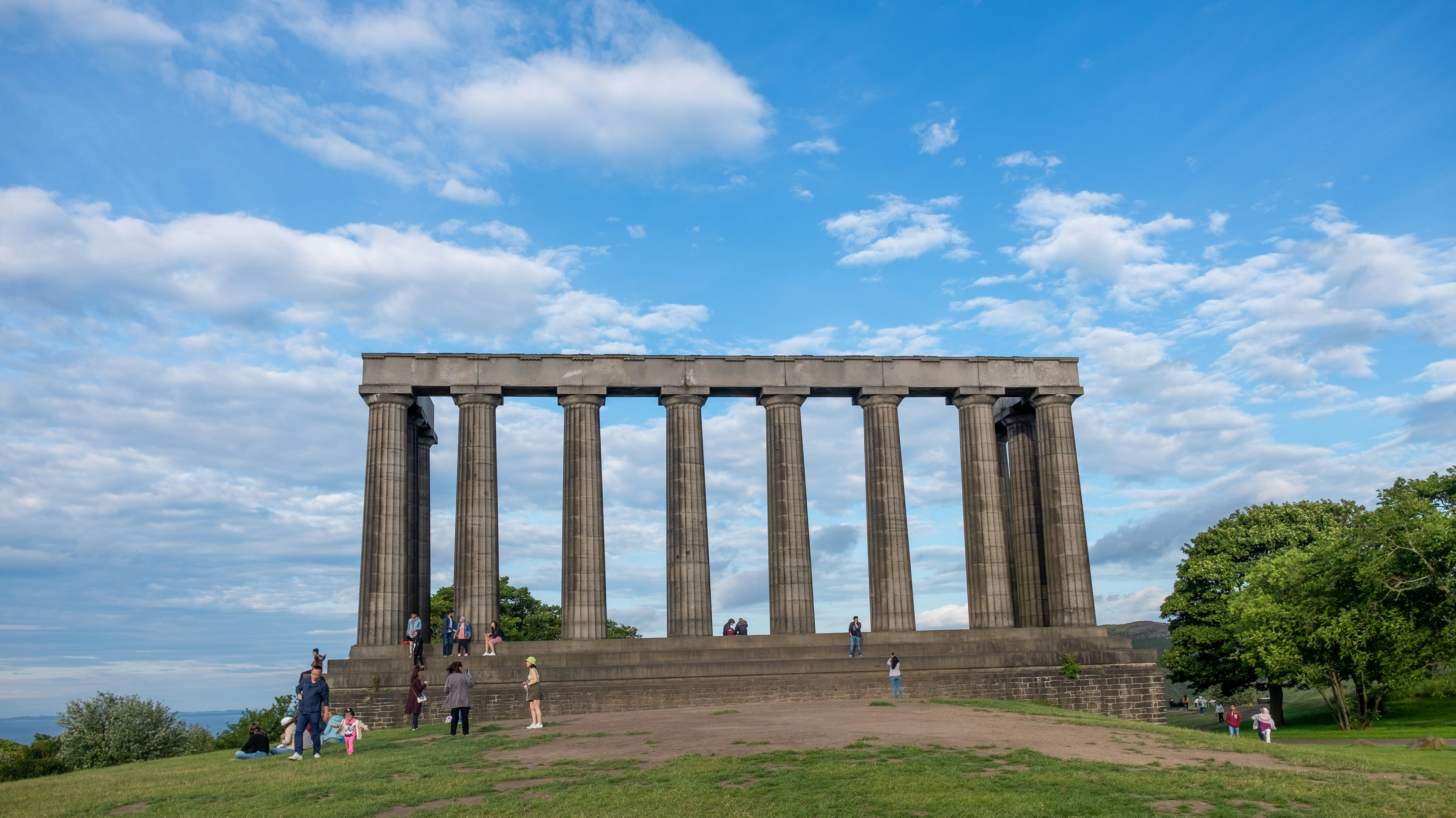 Hilltop Doric Colonnade Framed by a Cloud-Swept Sky