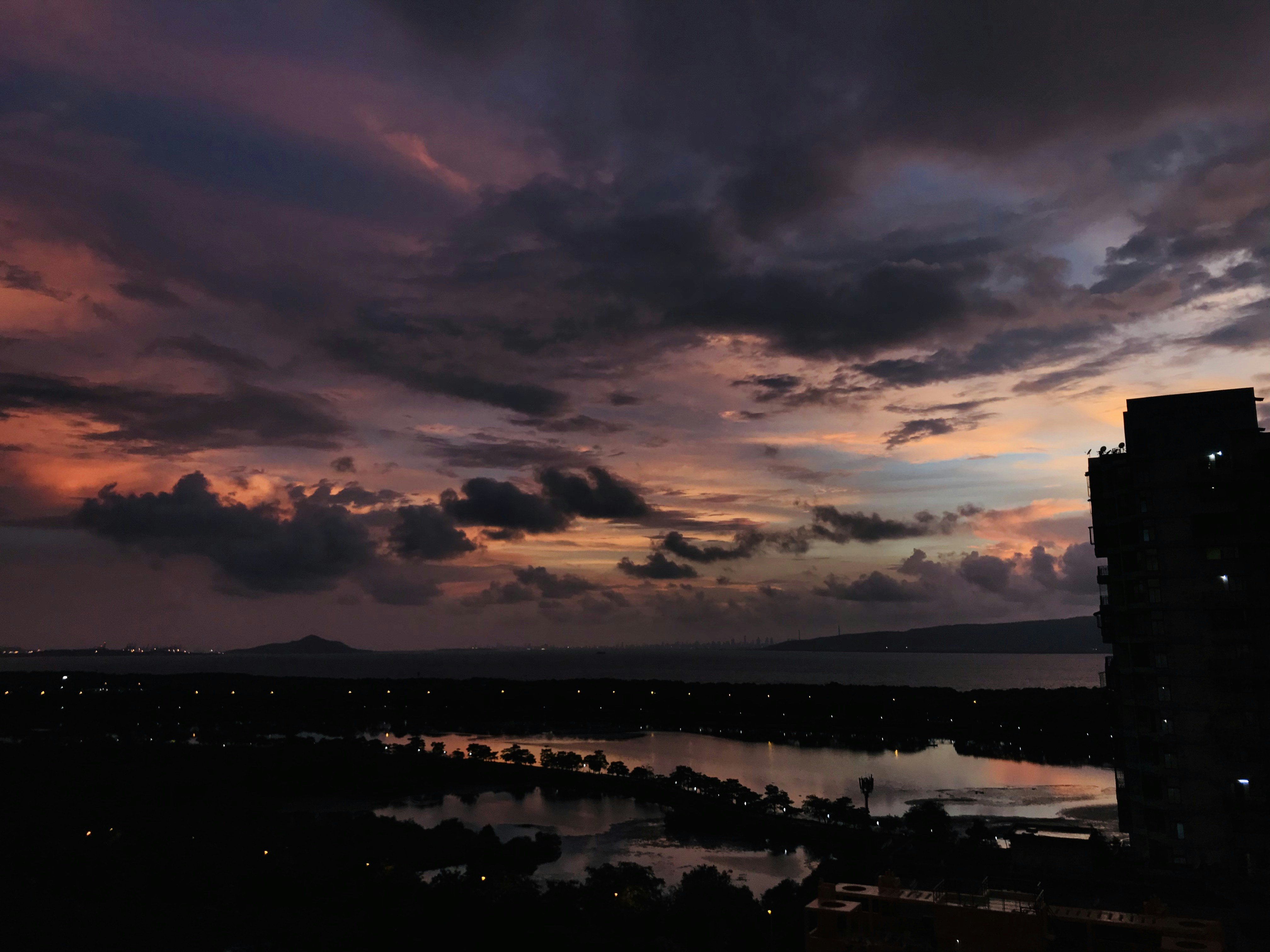 Sunset Ribbon Along a Silhouetted Skyline