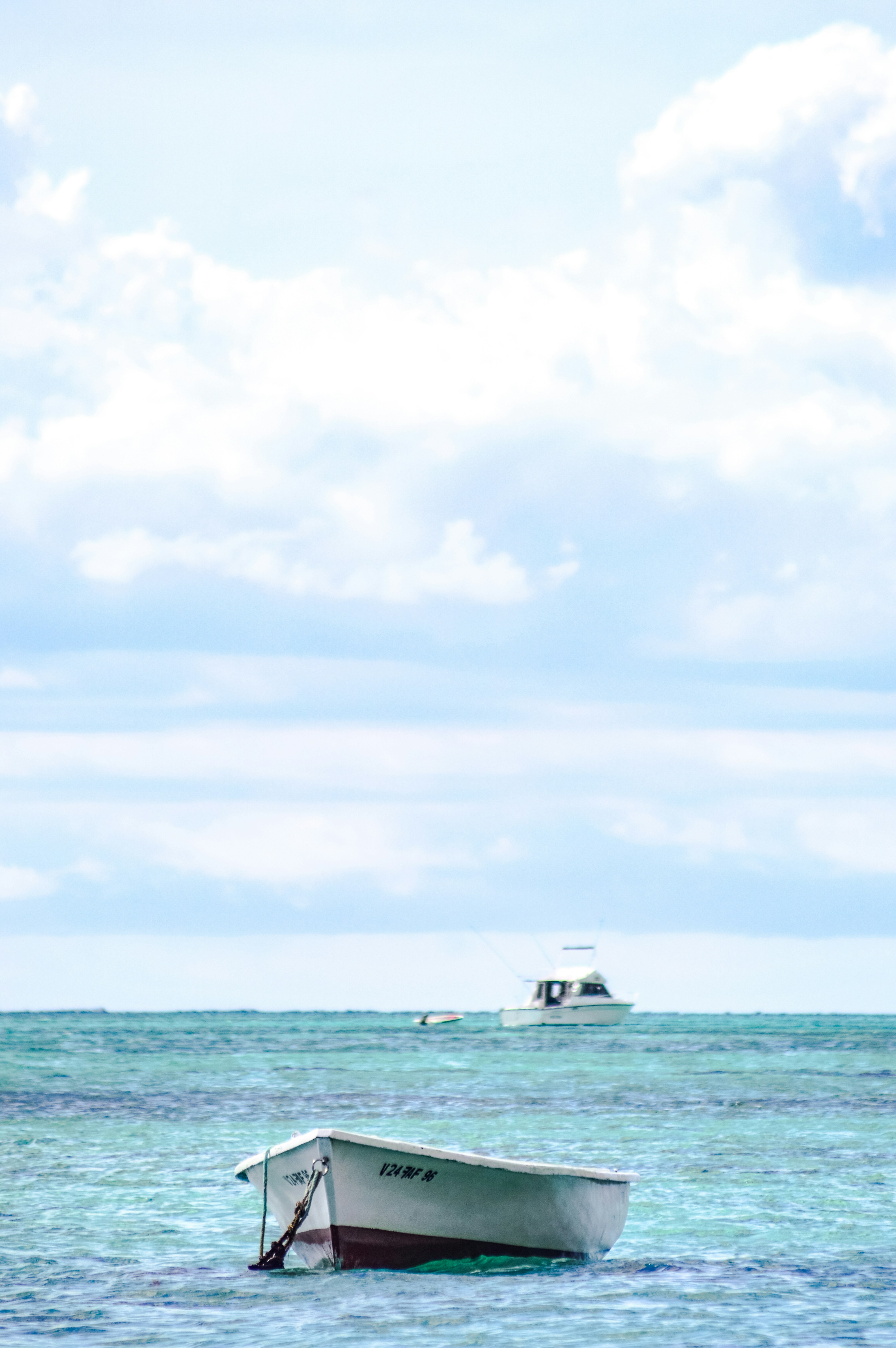 White row boat at the body of water photo – Free Beach Image on Unsplash