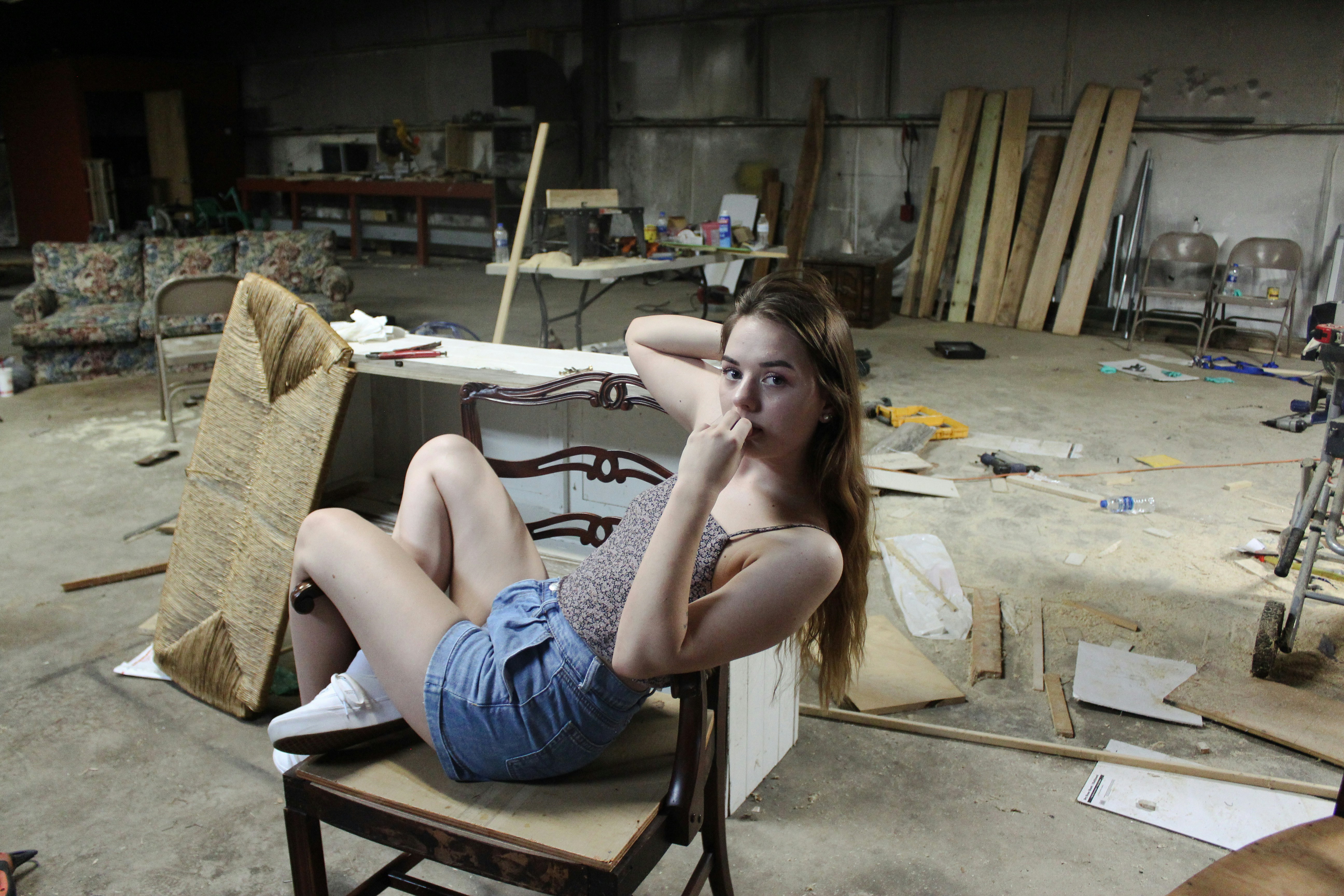 Dusty Studio Gaze: A Portrait of Calm in a Cluttered Workshop