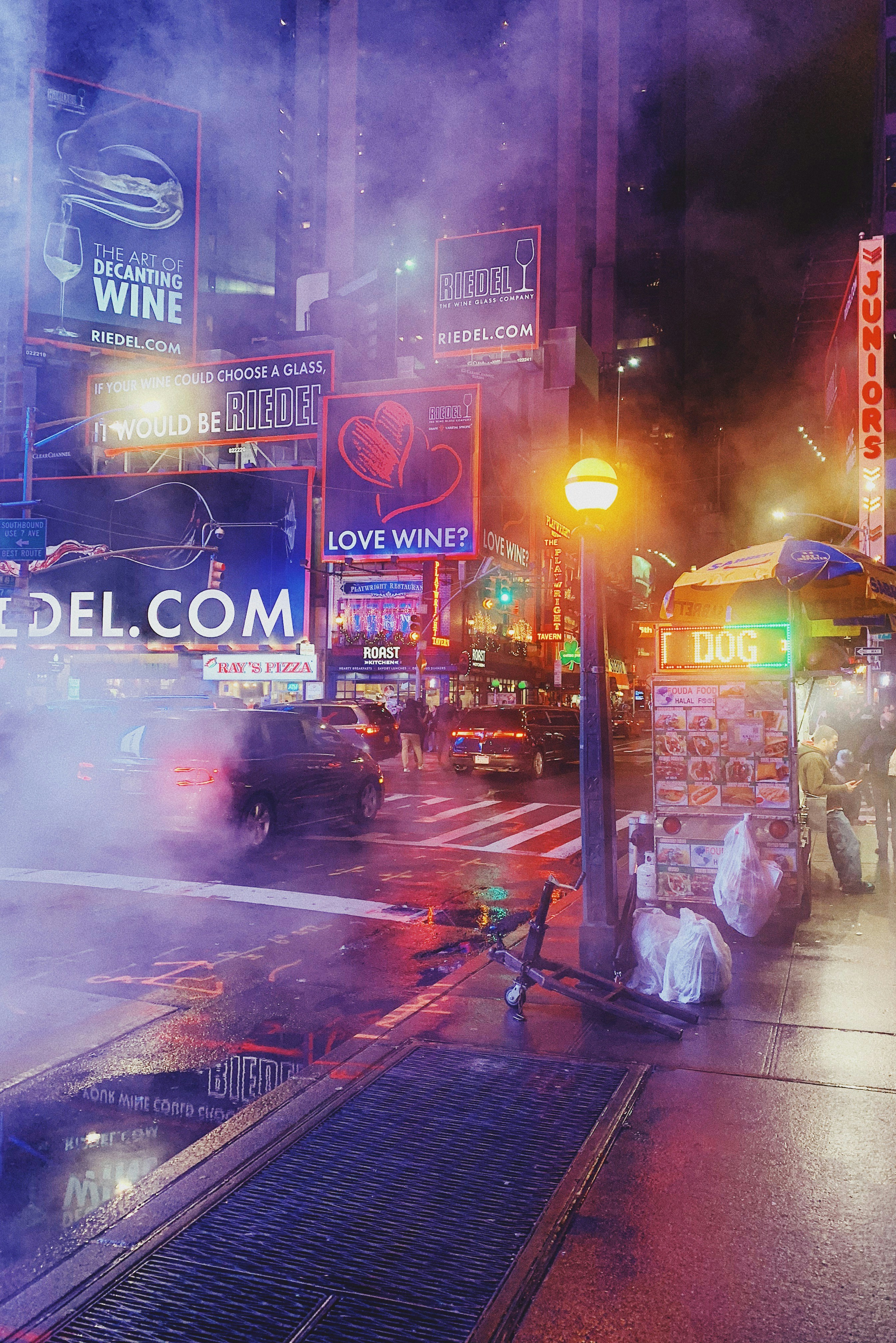 Neon Orchard: Rain-Slicked Street with Steam and Signs in Times Square Night