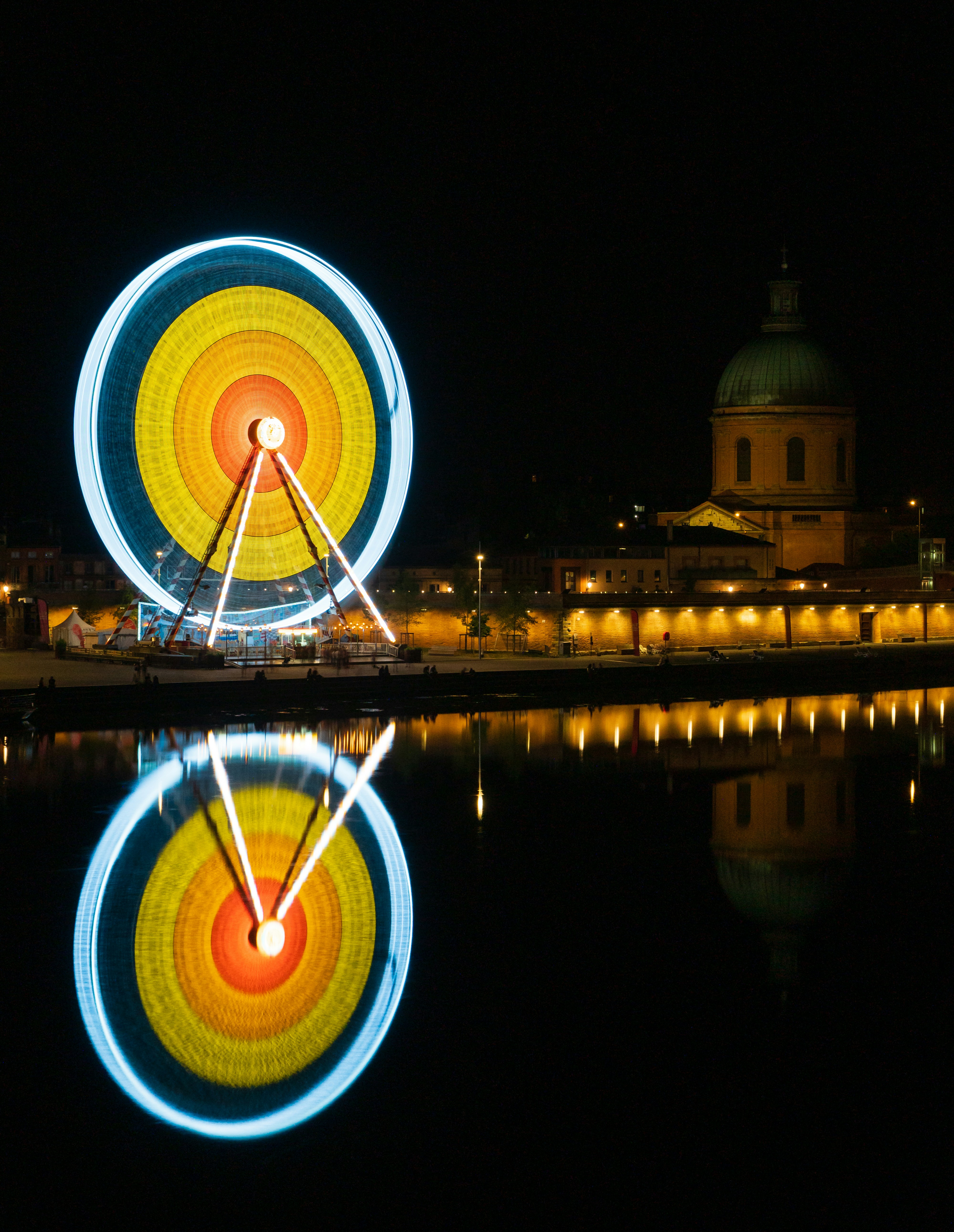 Rings of Light Over the River: A Night Ferris Wheel