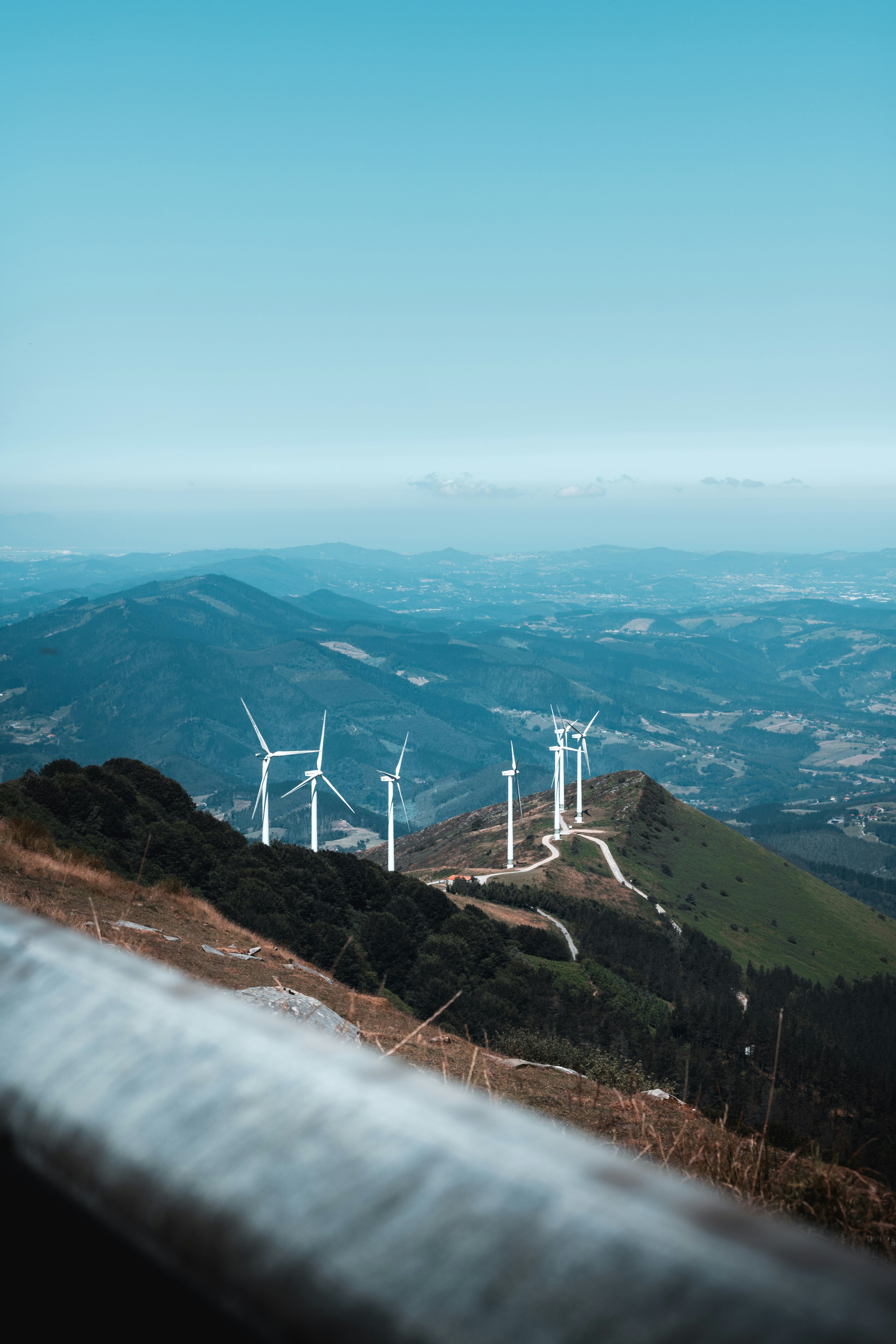 Ridgeline Sentinels: Wind Turbines Punctuate the Blue Mountain Horizon