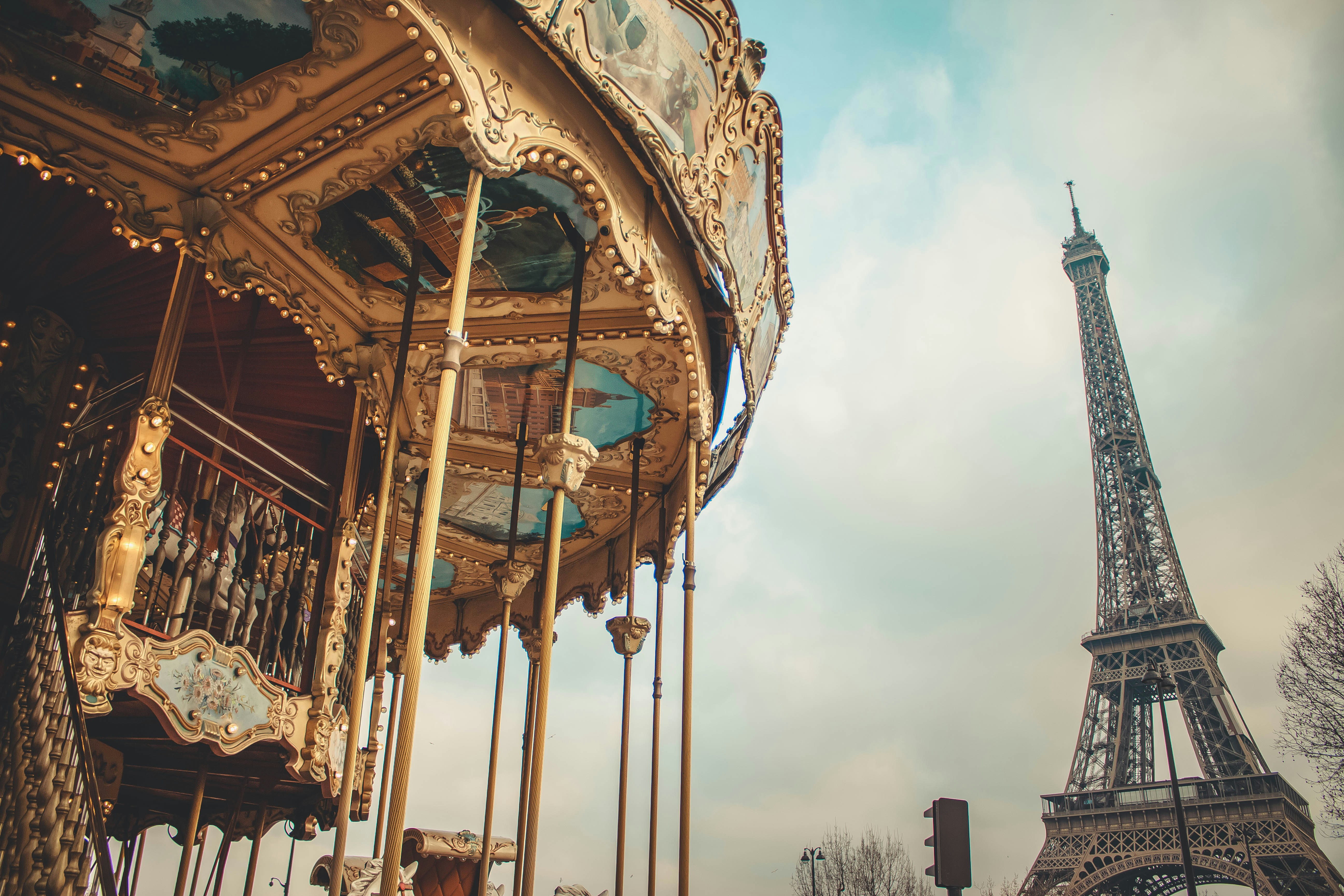 a carousel in front of the eiffel tower
