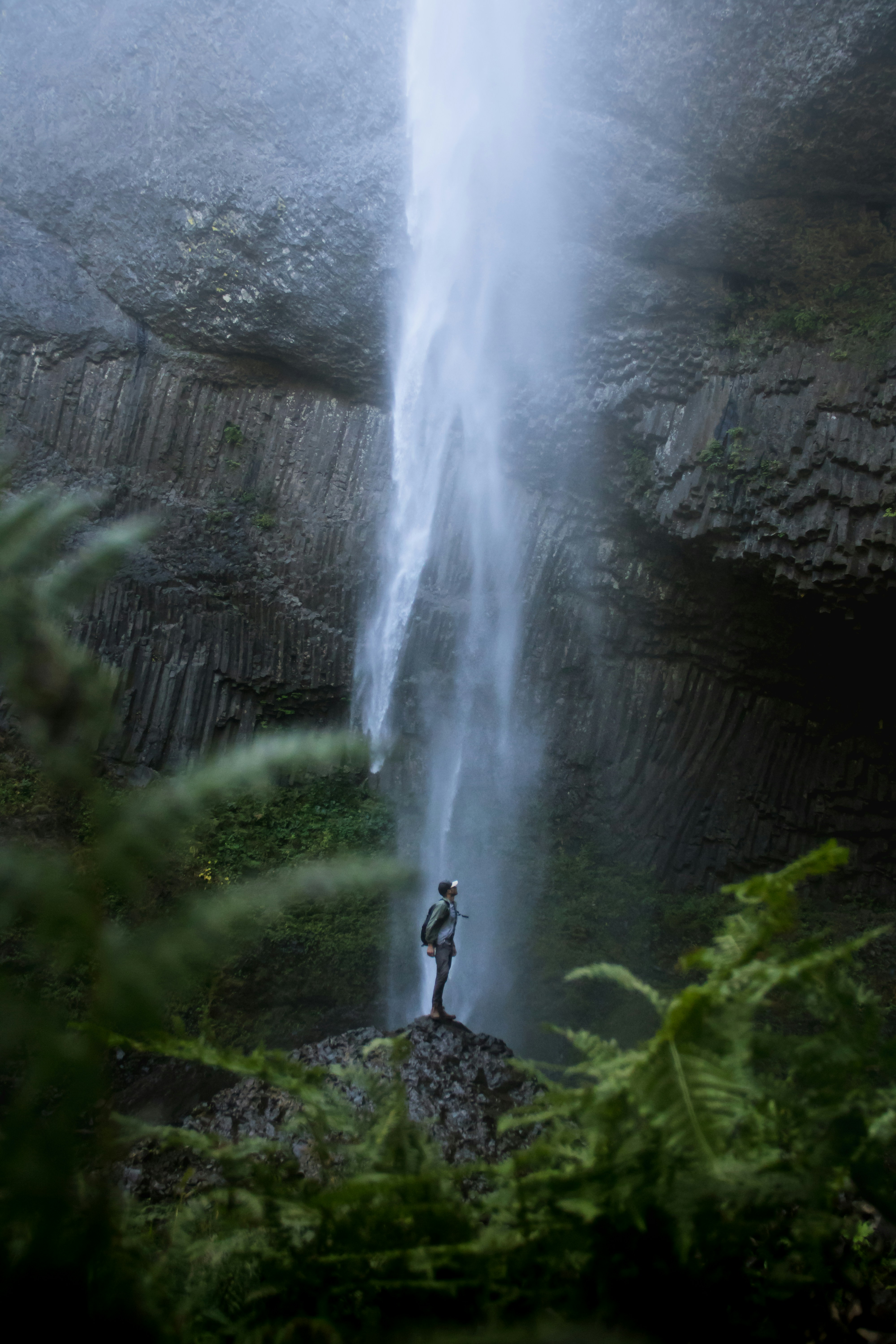 Person standing near waterfalls photo – Free Grey Image on Unsplash