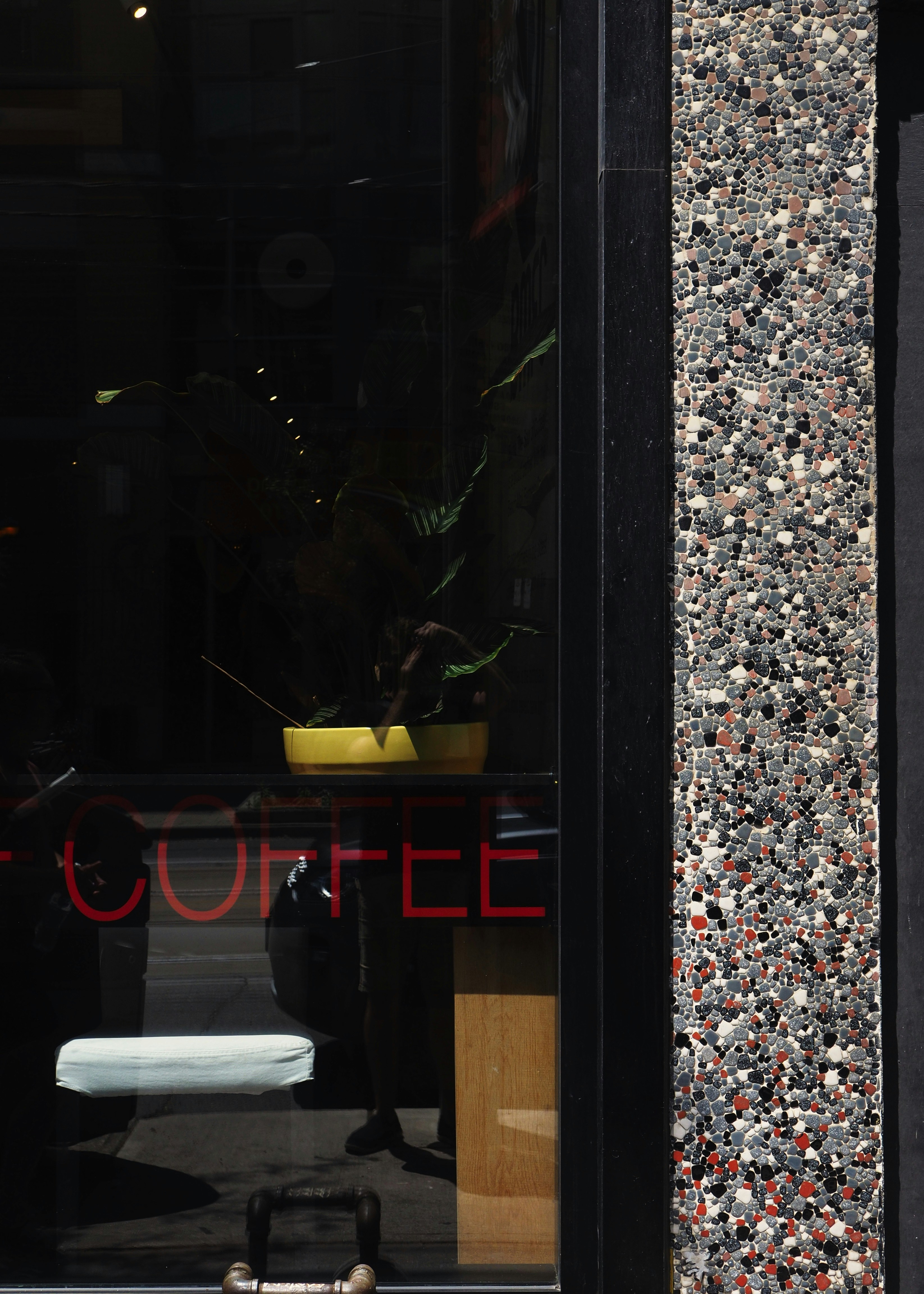 Yellow Vessel in the Glass: a Quiet Coffee Shop Portrait