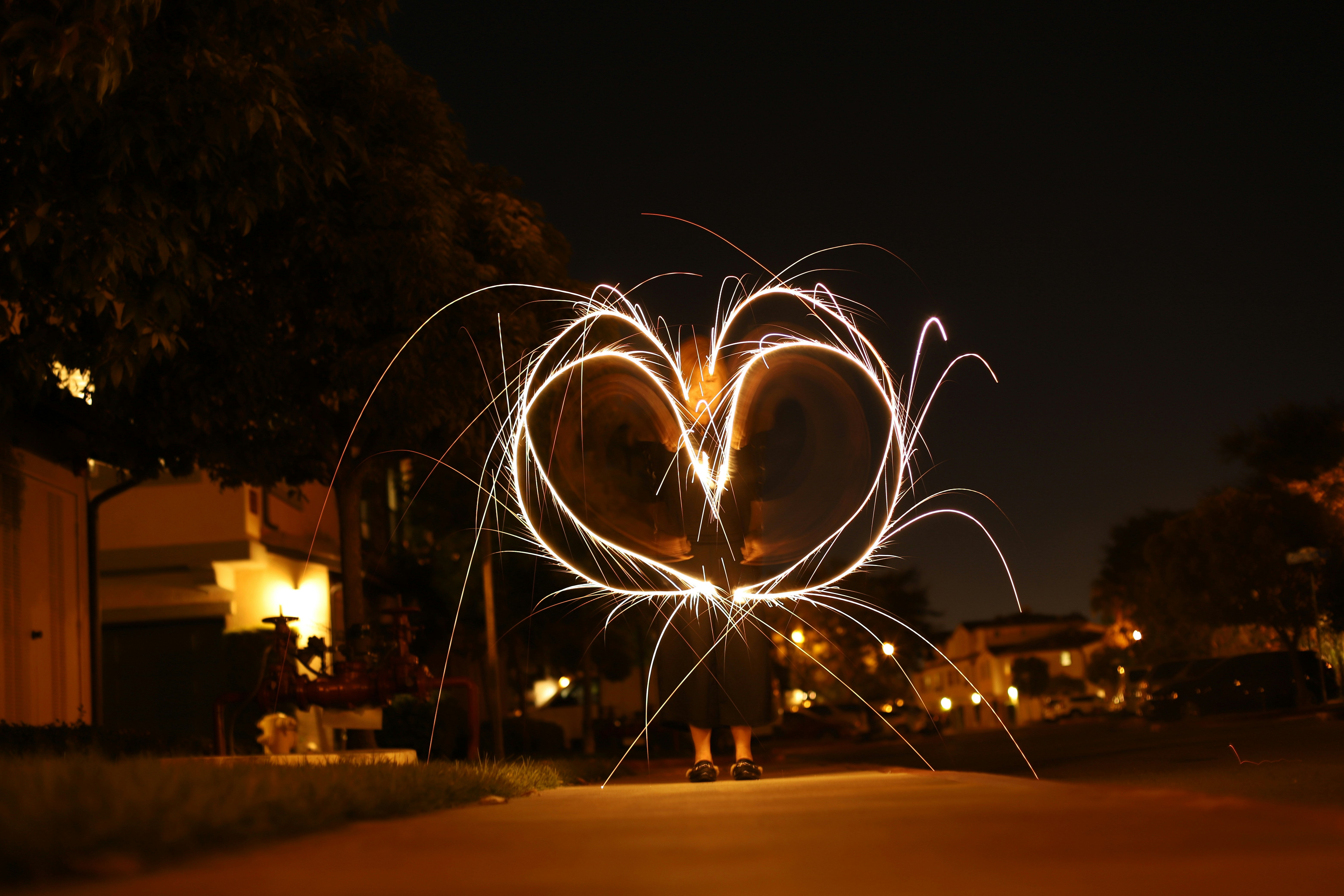 person doing light stunts during night time