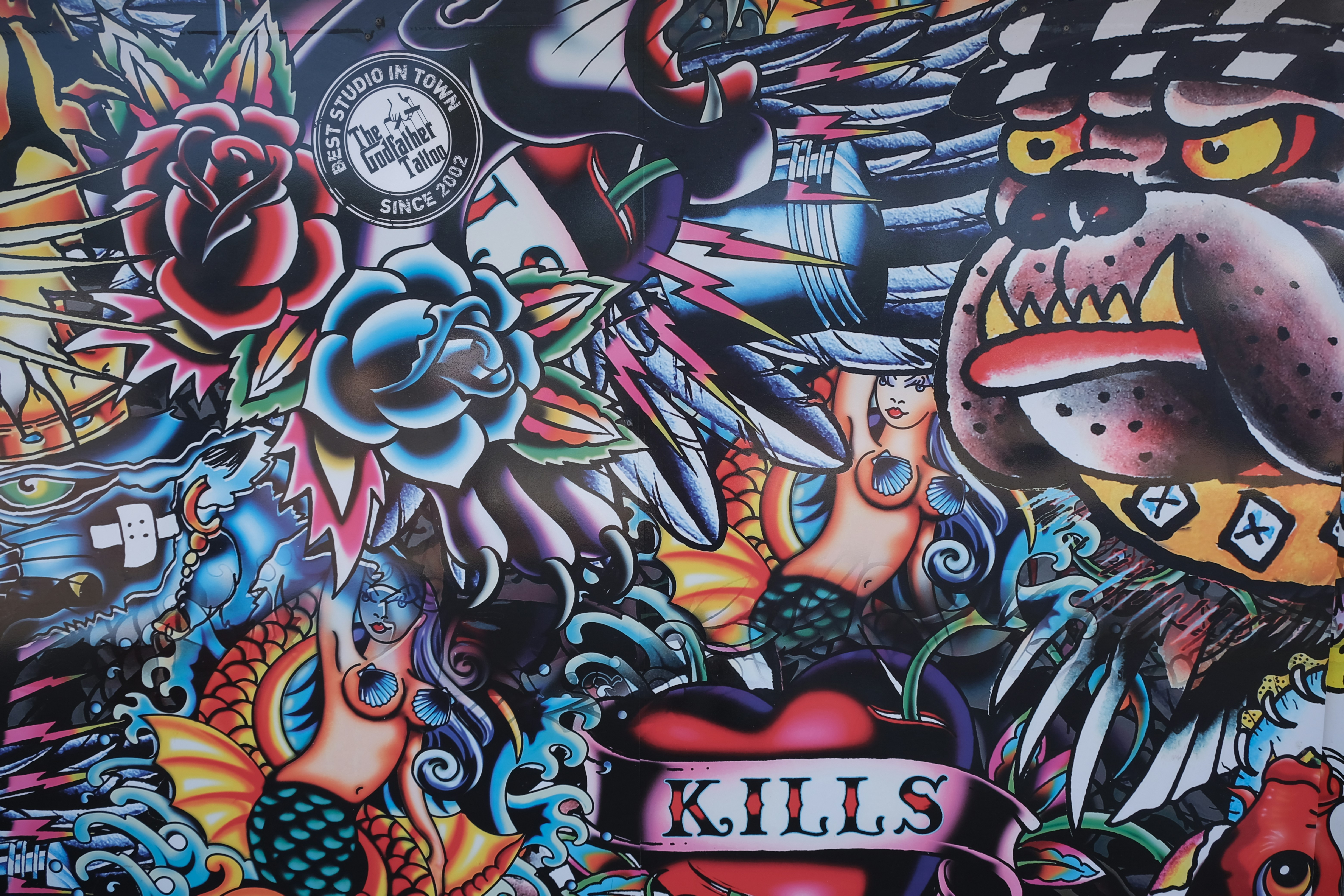 Chromatic Chaos: A Burst of Tattooed Flora and Fanged Faces