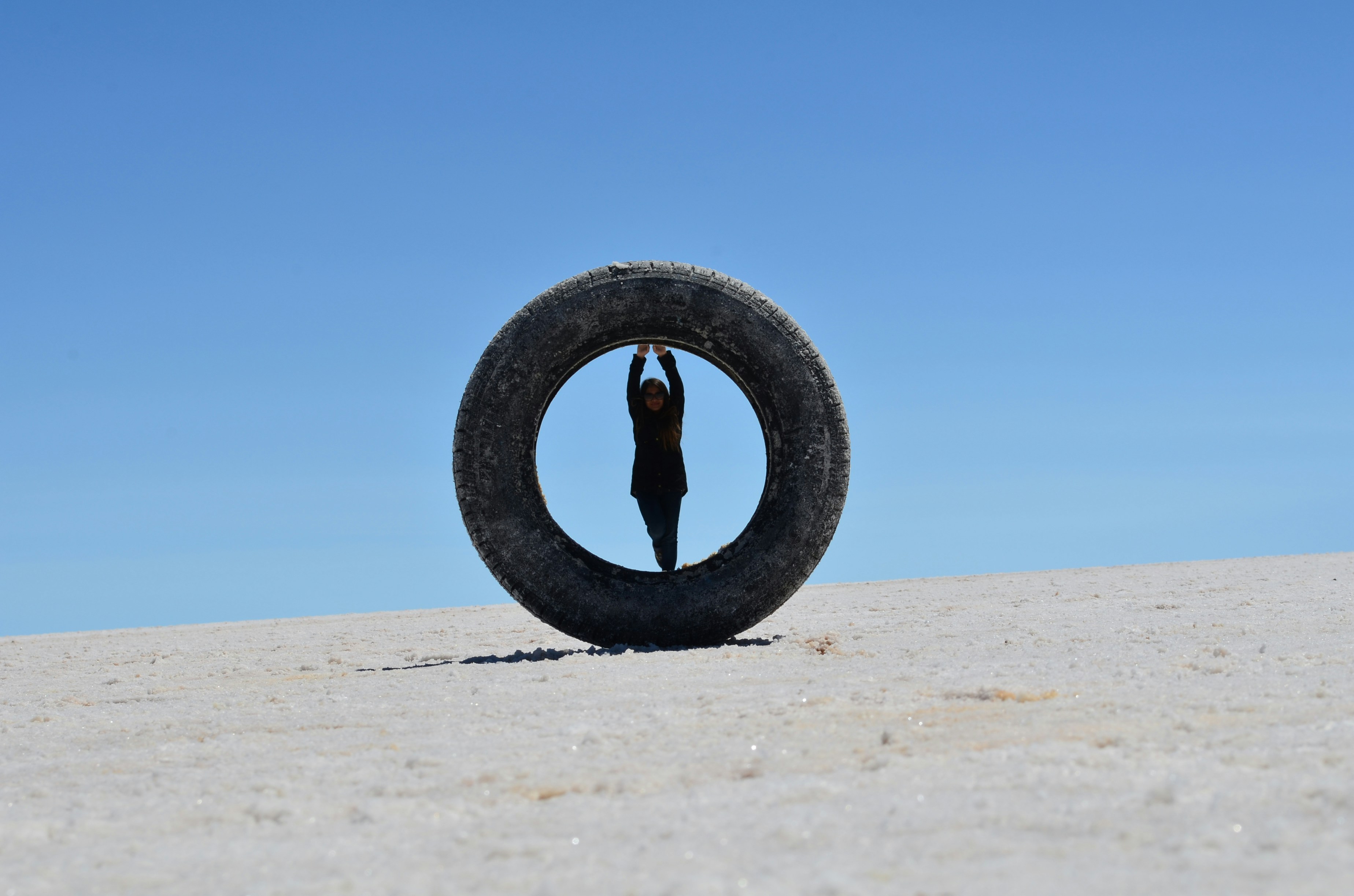 person standing on big hoop during daytime