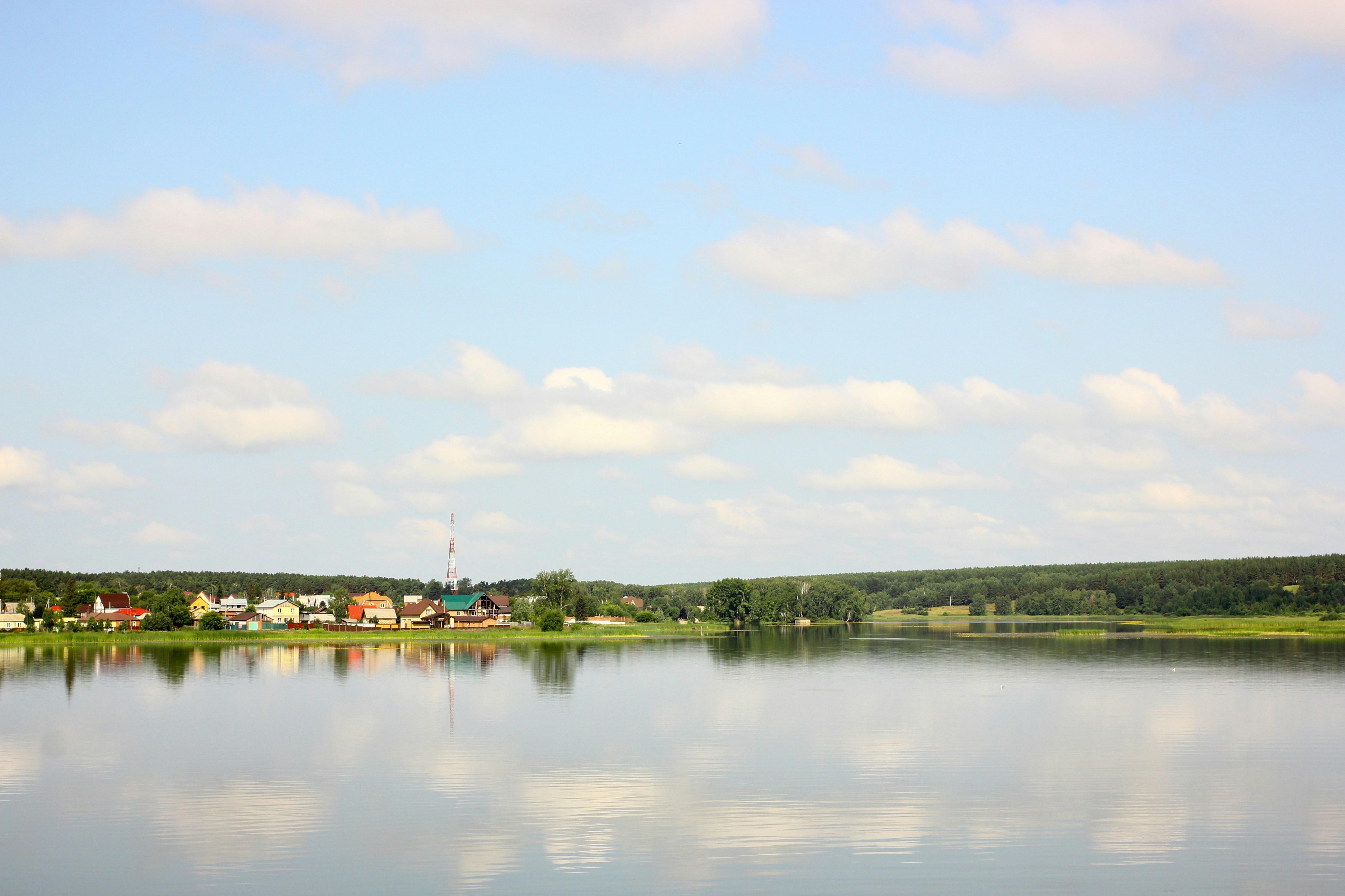 Red-Roofed Riverside: Quiet Village Along a Mirror-Lake