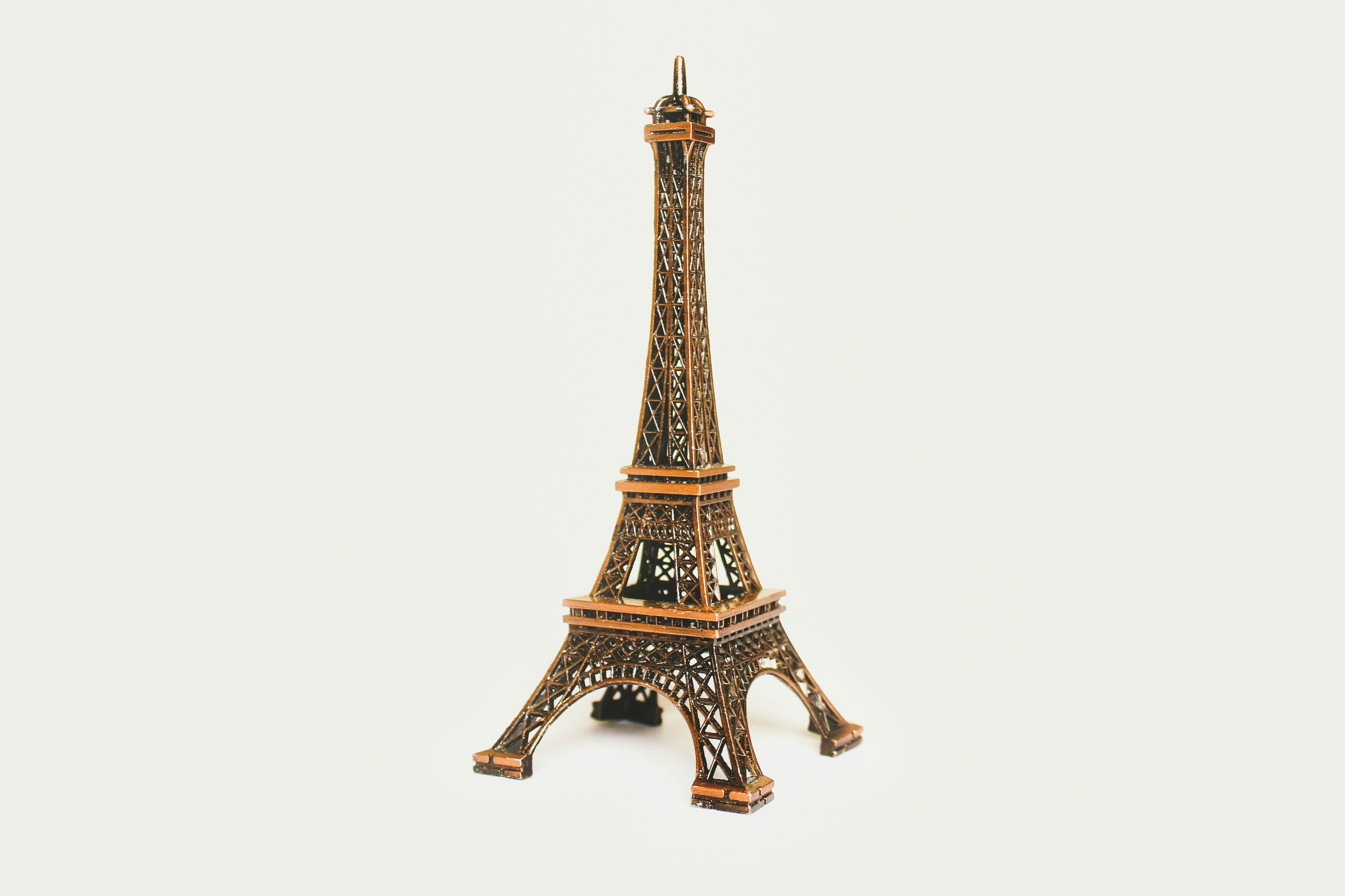 Miniature Tower: A Delicate Eiffel Replica on Clean White