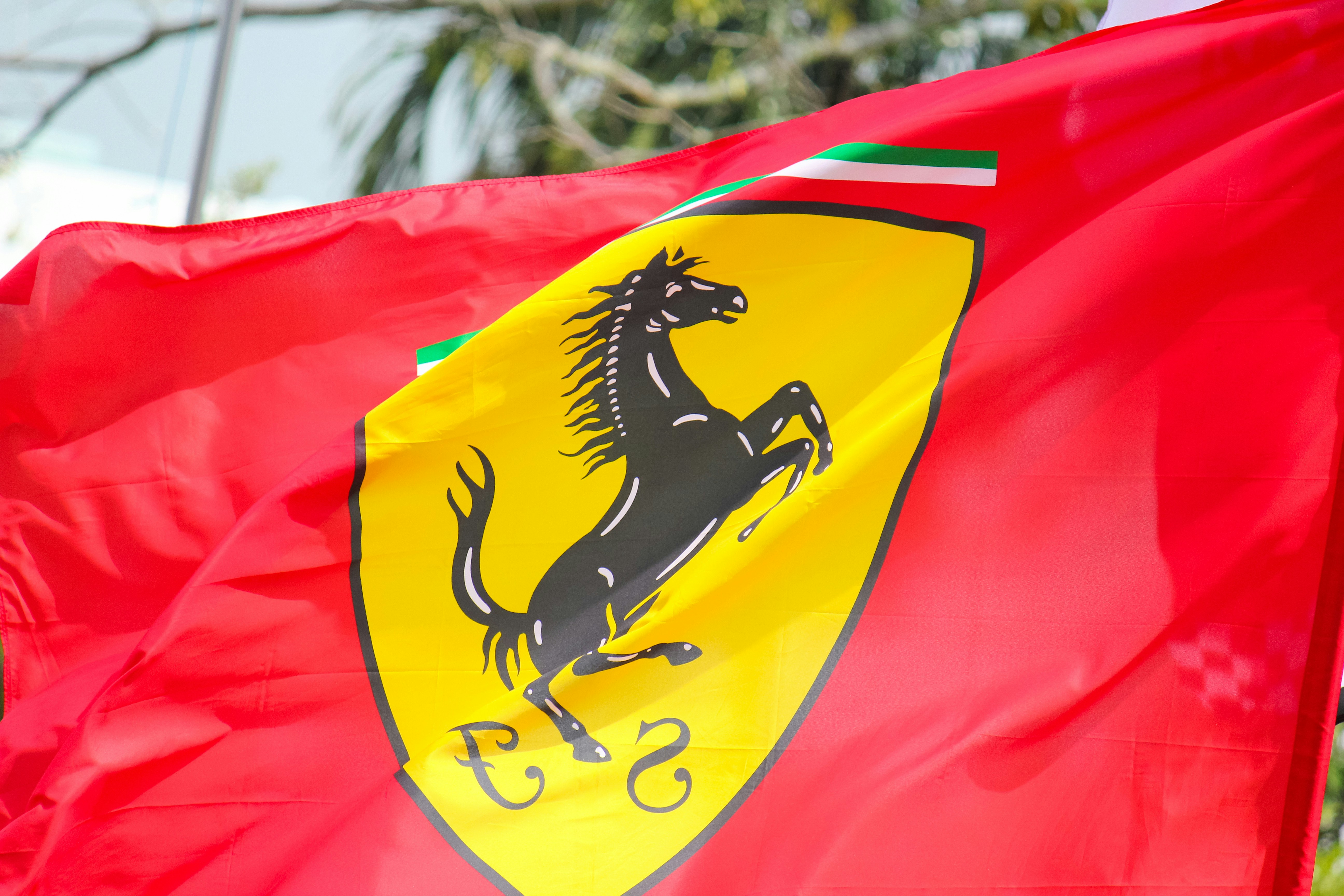 Ferrari flag photo – Free Yellow Image on Unsplash