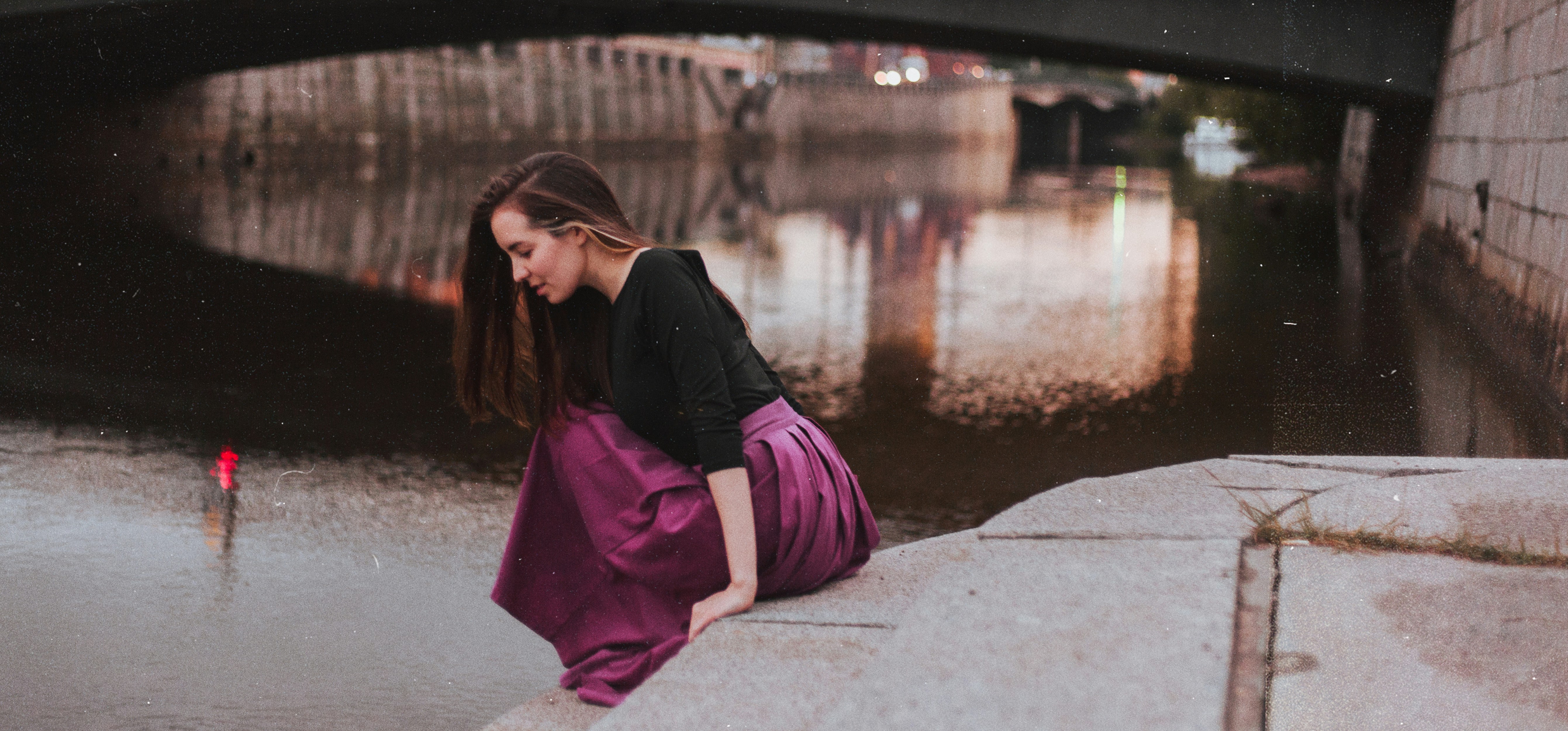 Magenta Moment on the Riverside Edge Under the Bridge