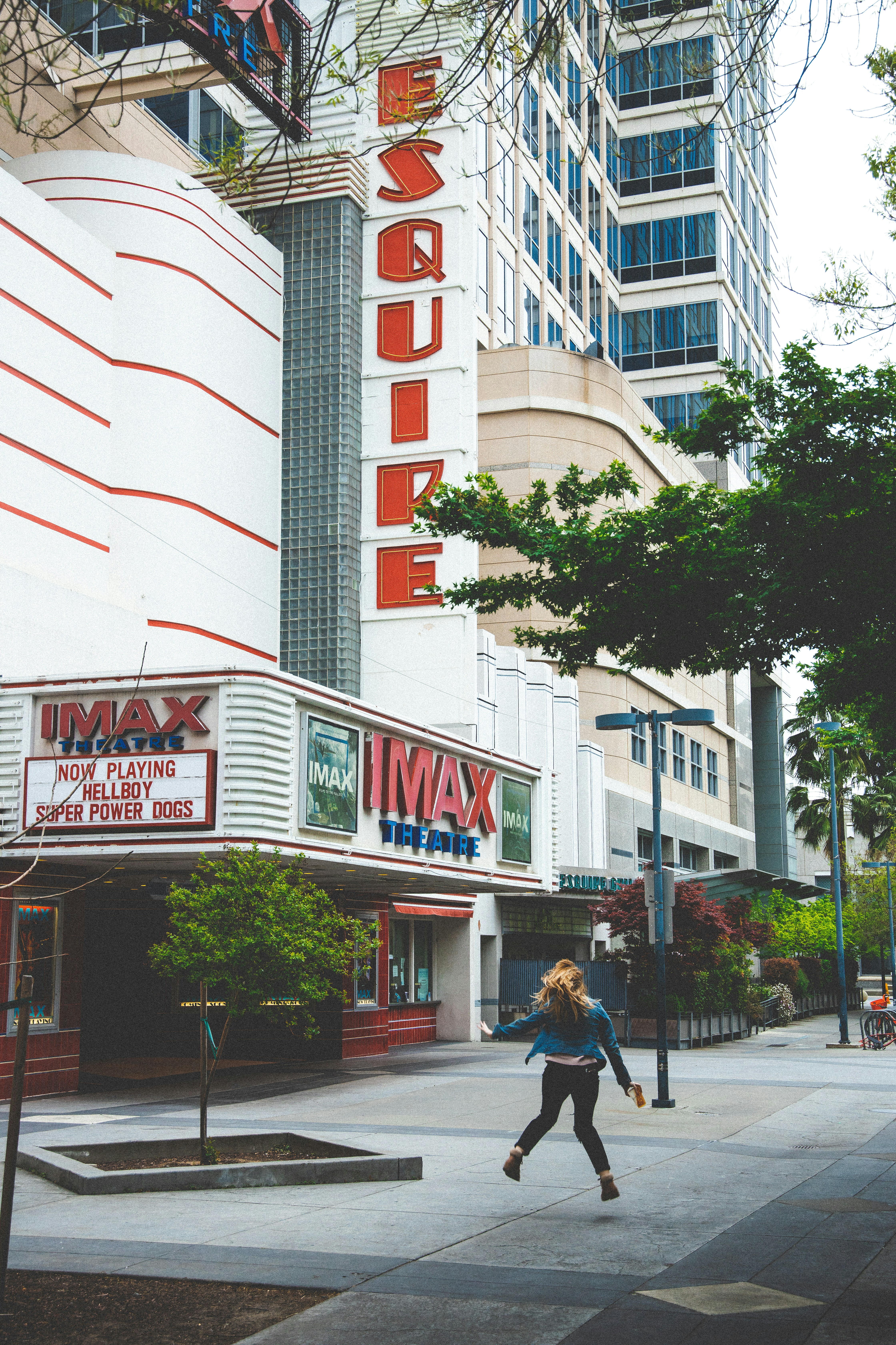 Woman in blue jacket and b lack pants near Imax photo – Free City Image ...