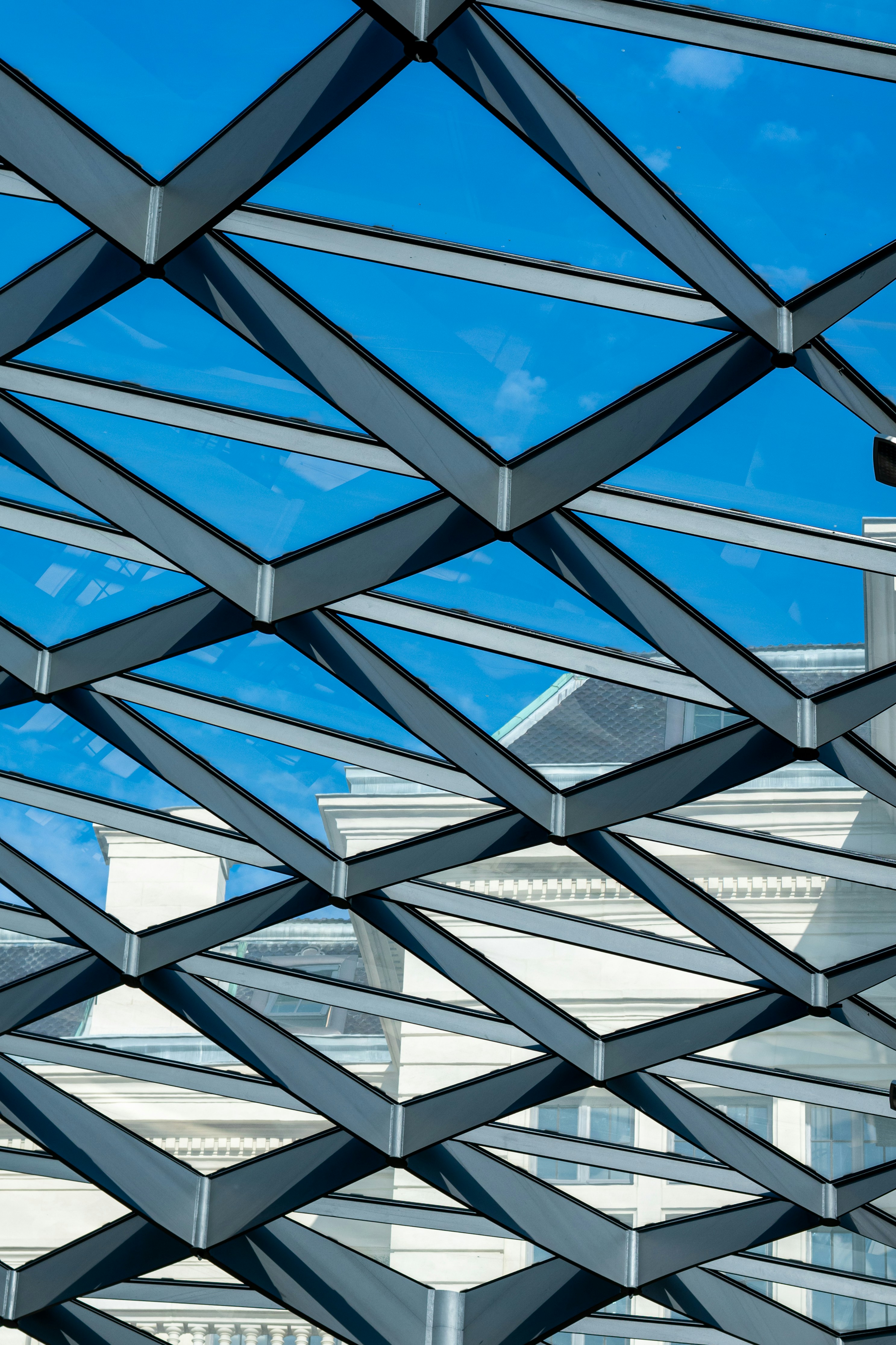 Gray glass building under blue and white skies photo – Free Blue Image ...