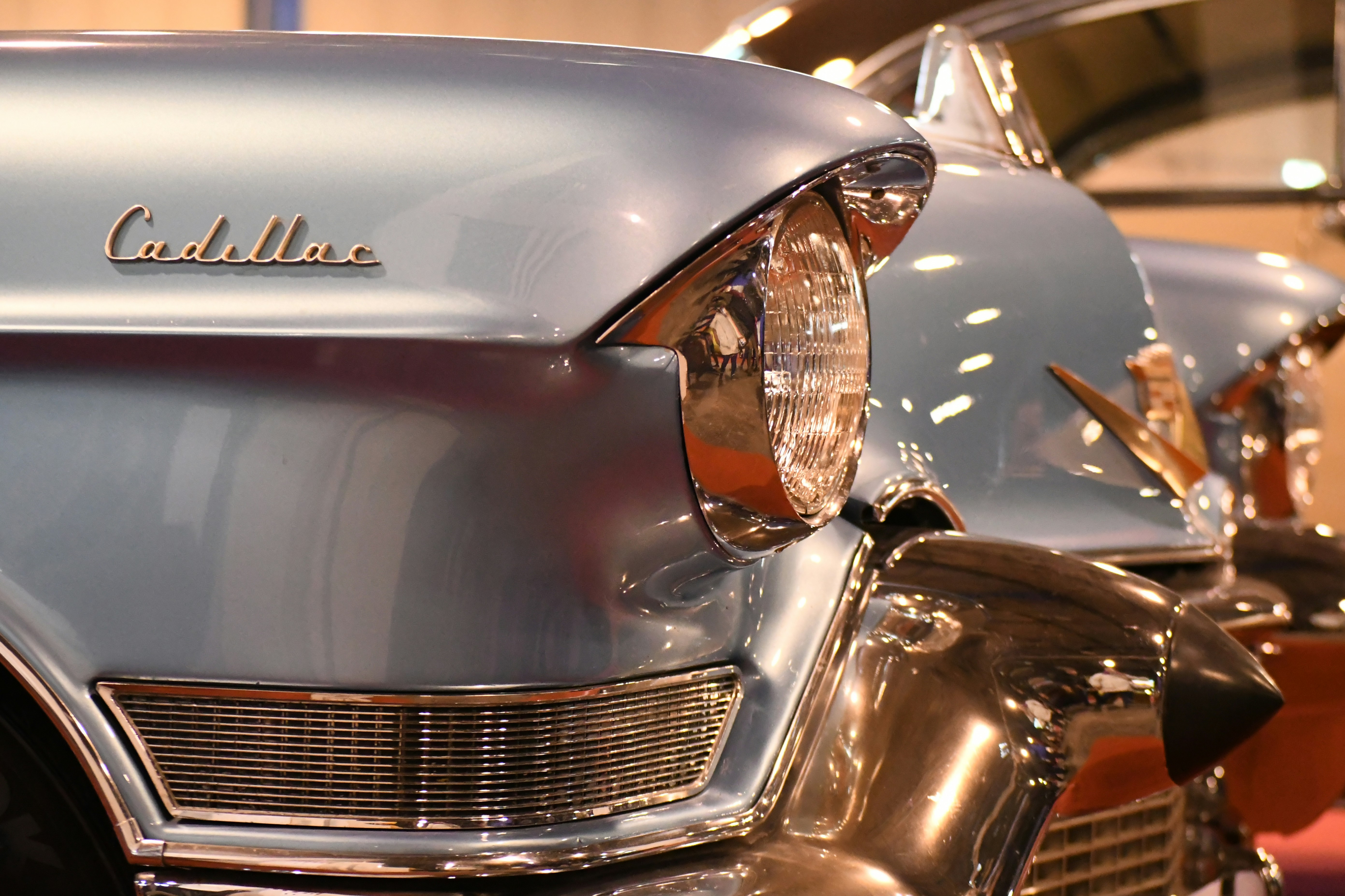 Azure Chrome: Close-Up of a 1950s Cadillac's Grille and Headlamp