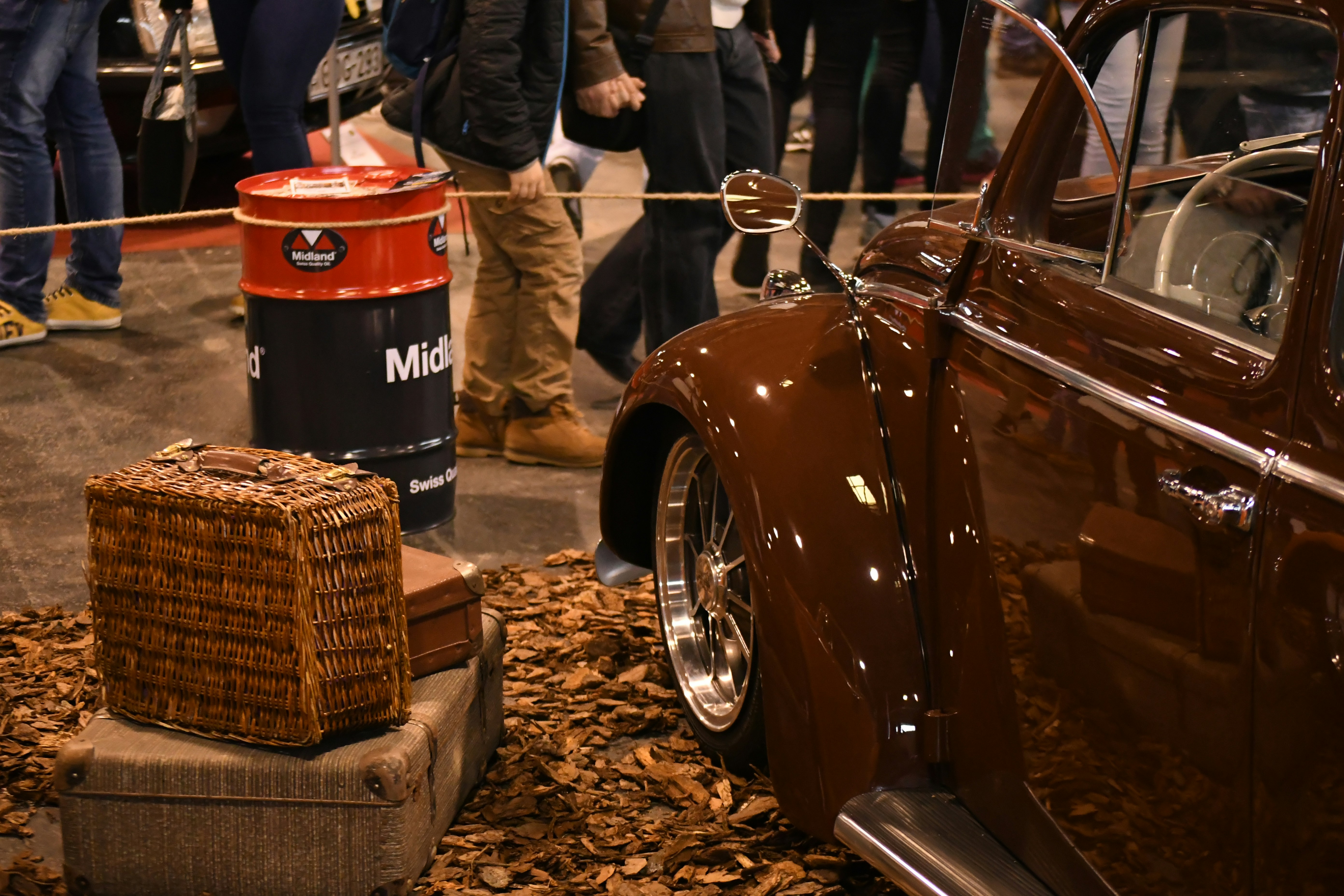 Bronze Curves Under Show Lights: A 1930s coupe at a quiet exhibition