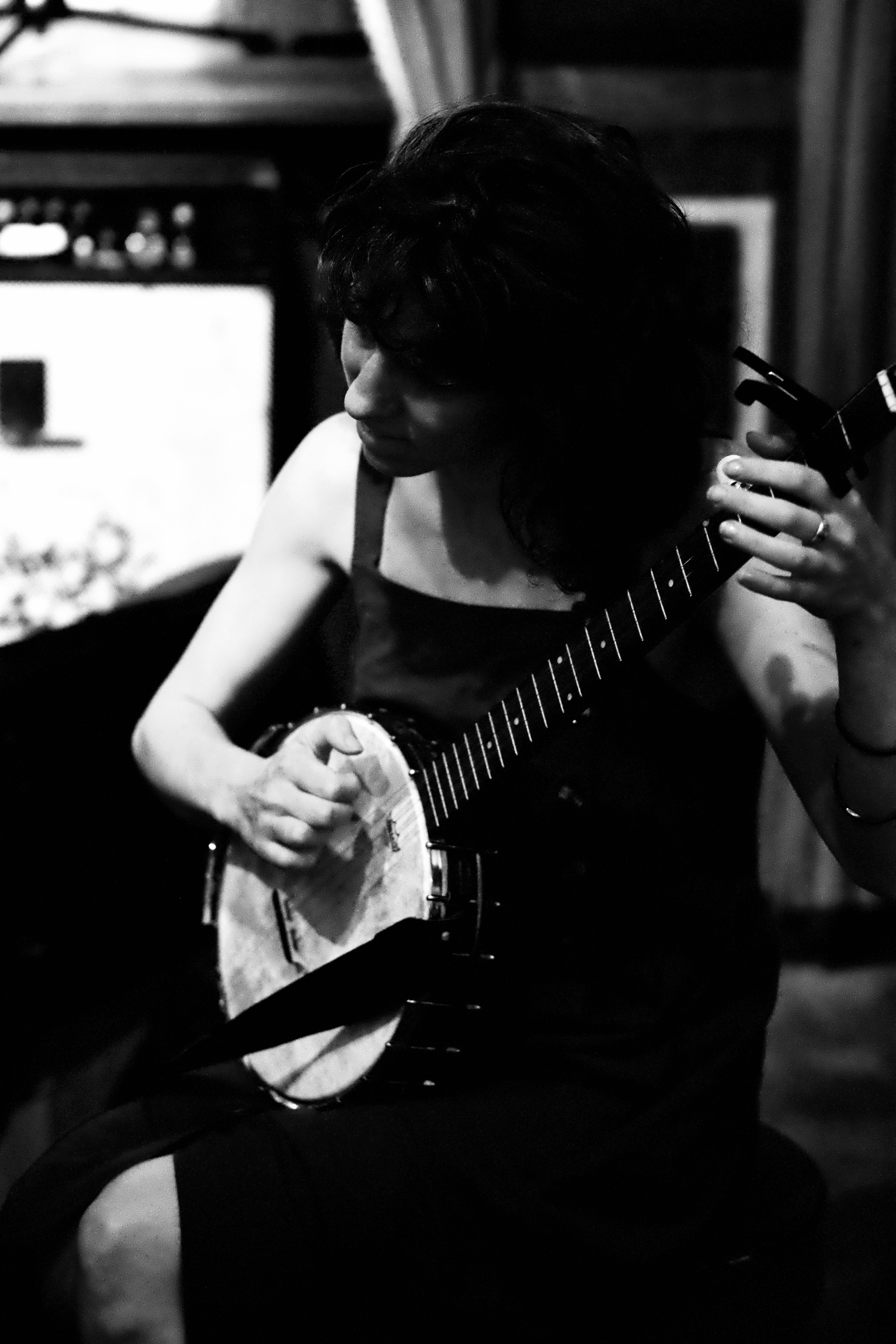 Midnight Strings: A Portrait of Quiet Focus with a Banjo-like Instrument
