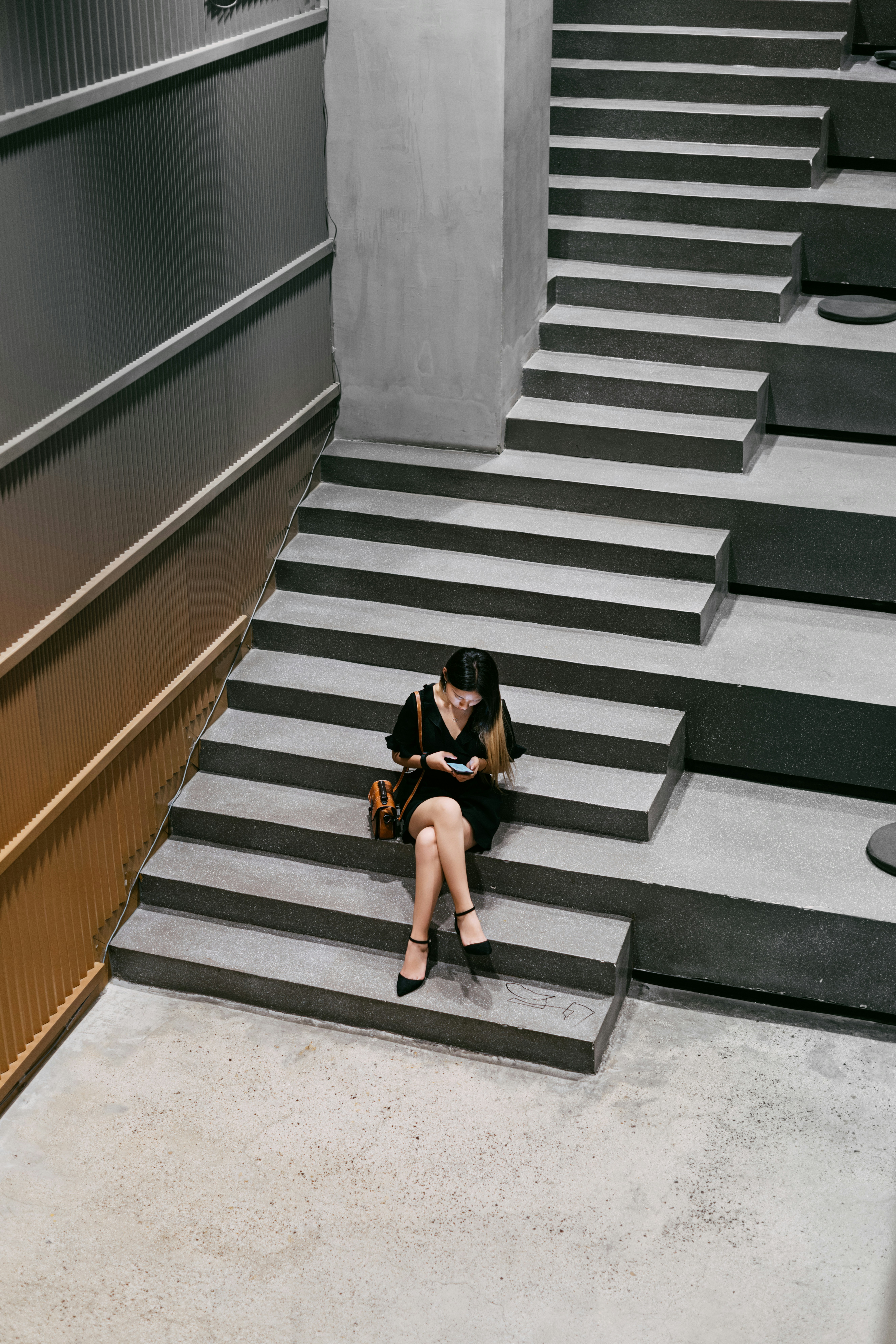 woman sitting on stairs photo – Free Road Image on Unsplash