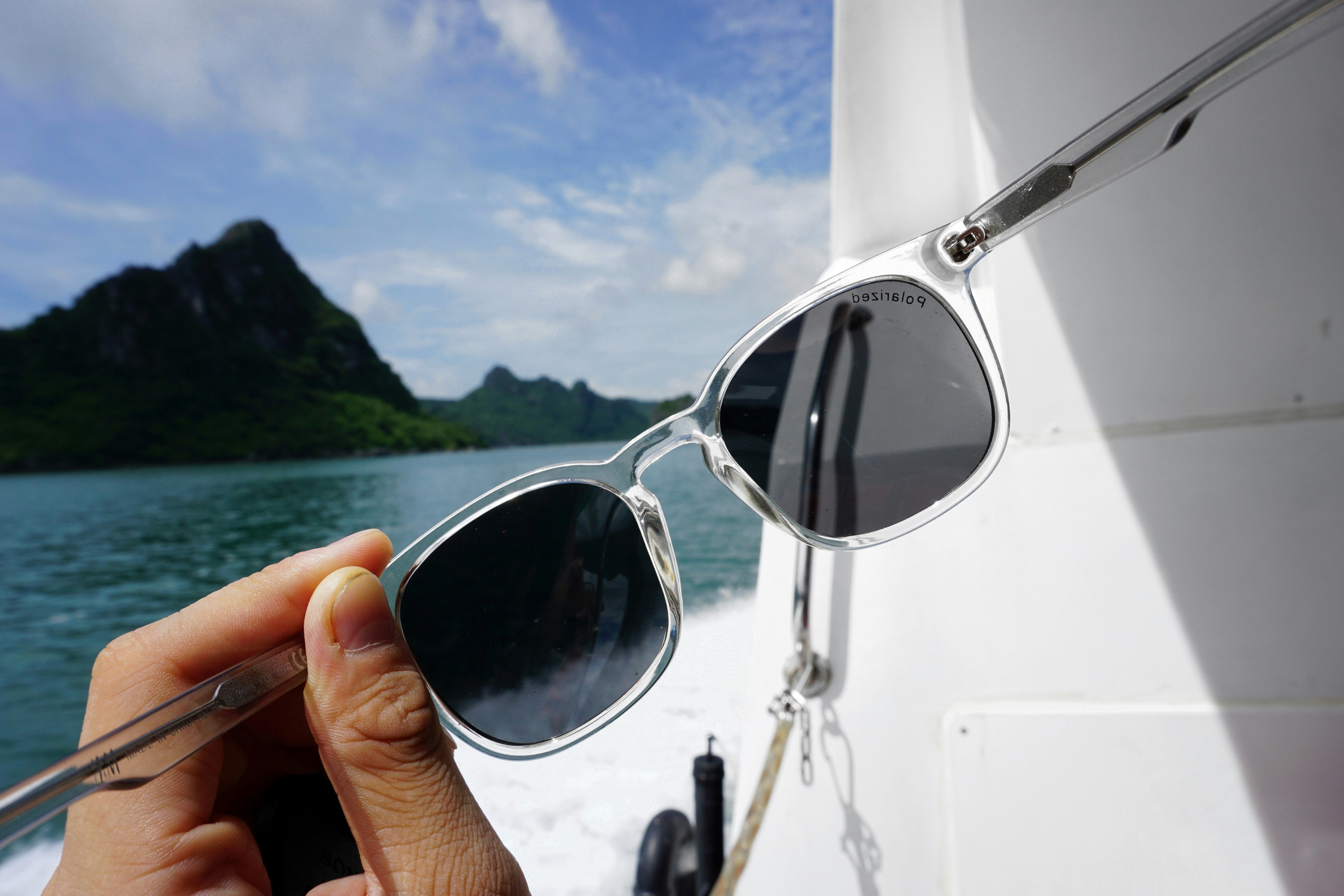 Sunglasses Frame Reflections on a Bright Seascape