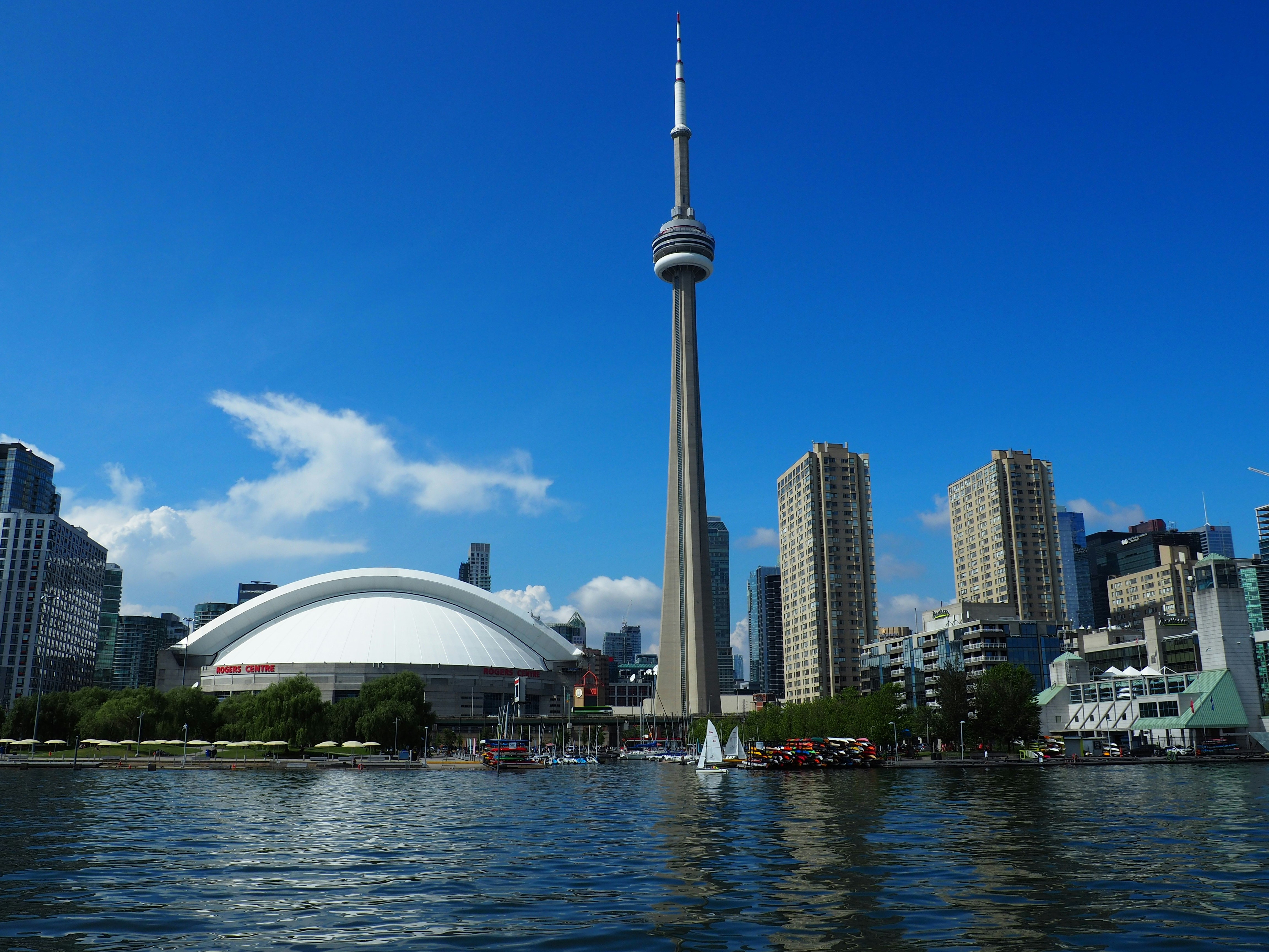 Grey concrete buildings near body of water during daytime photo – Free ...