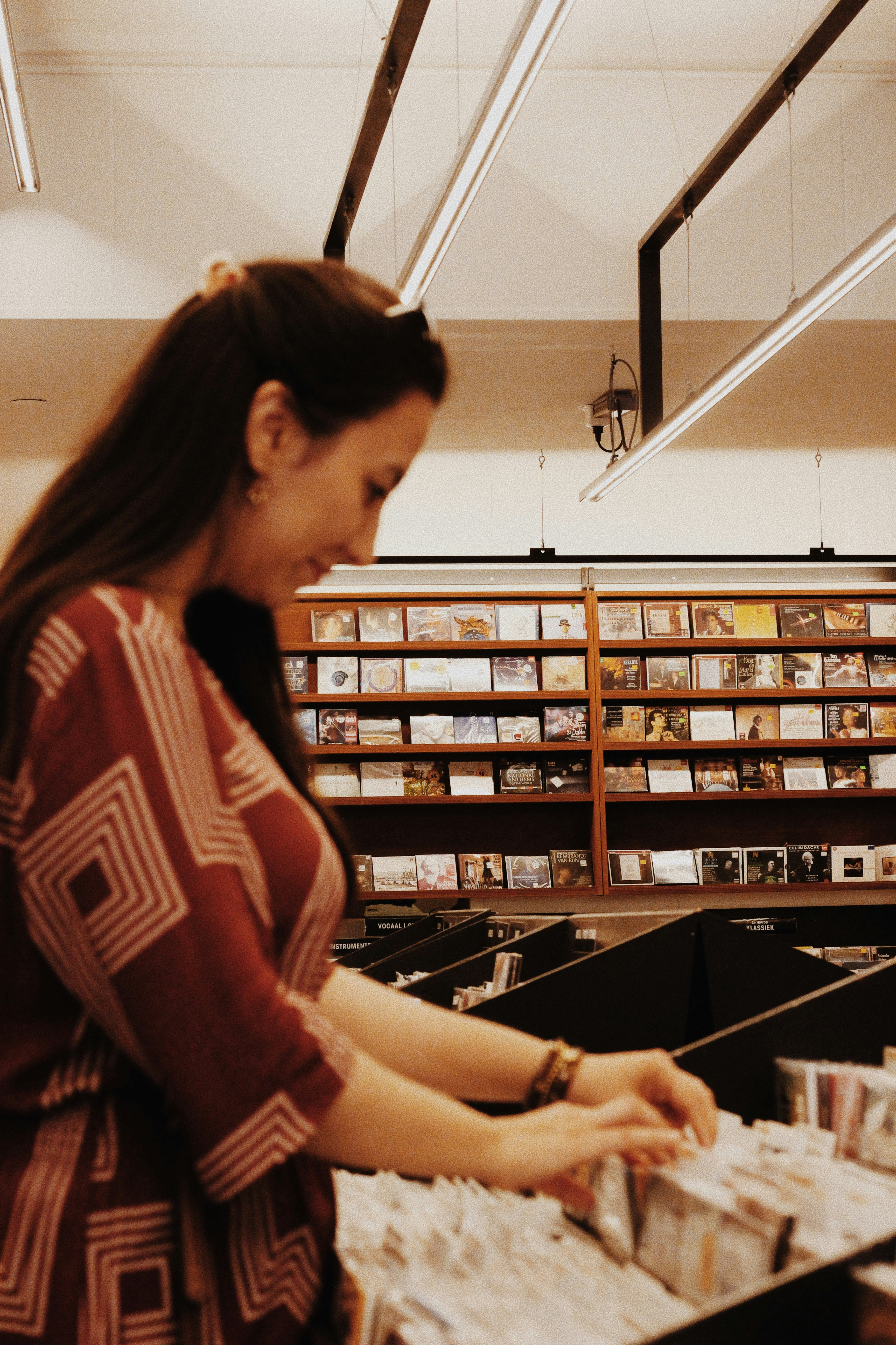 woman picking album
