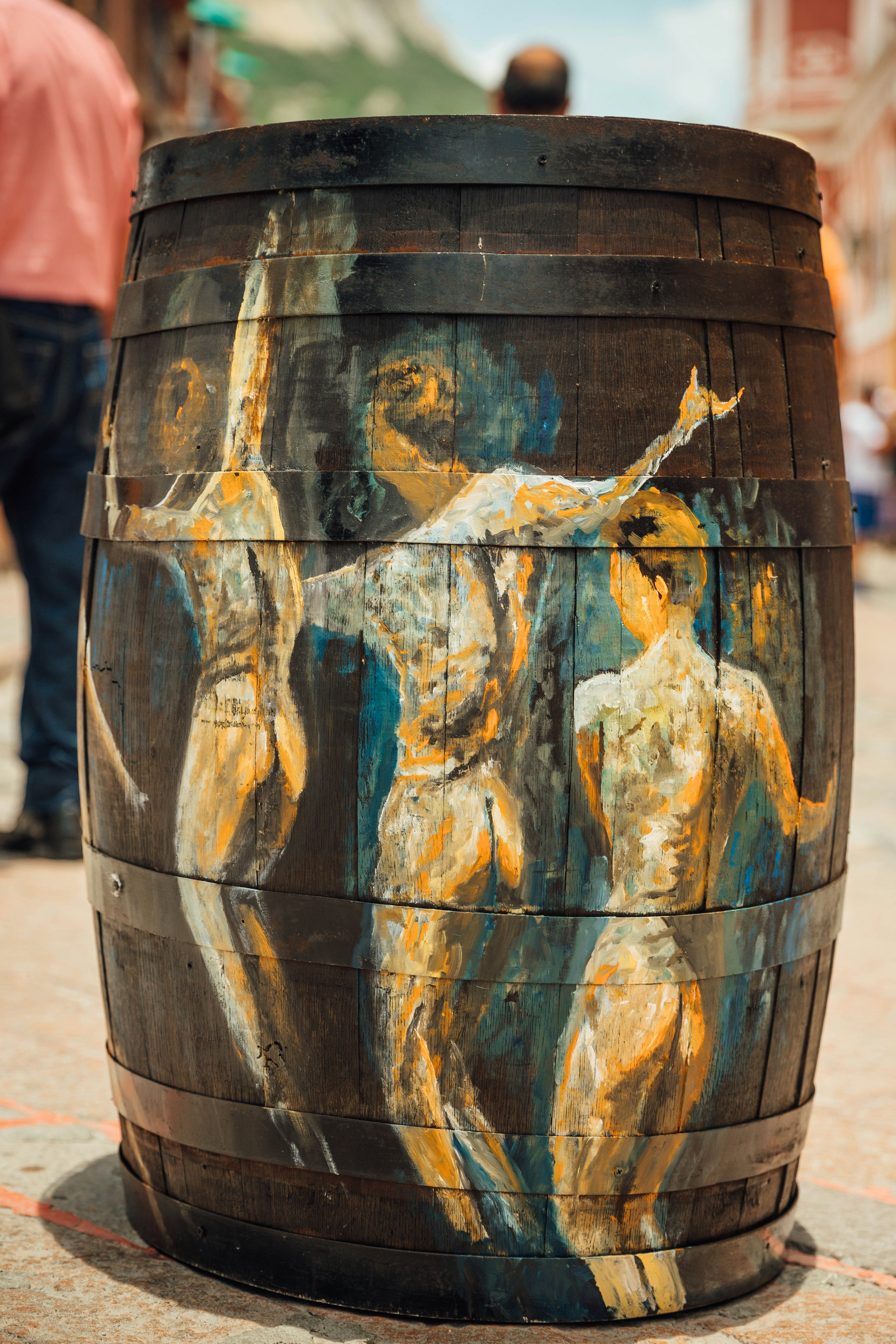 Dancing on Wood: A Street Barrel Wrapped in a Lively Mural