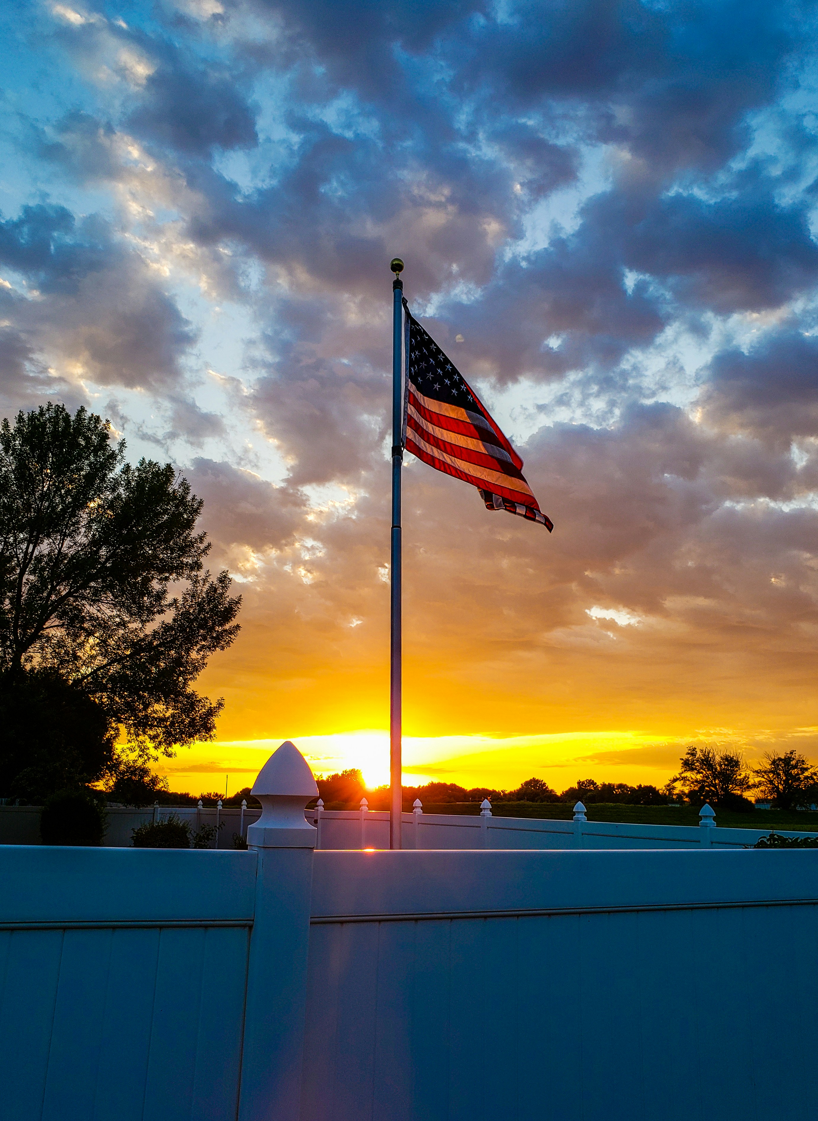 Neighborhood American flag at sundown