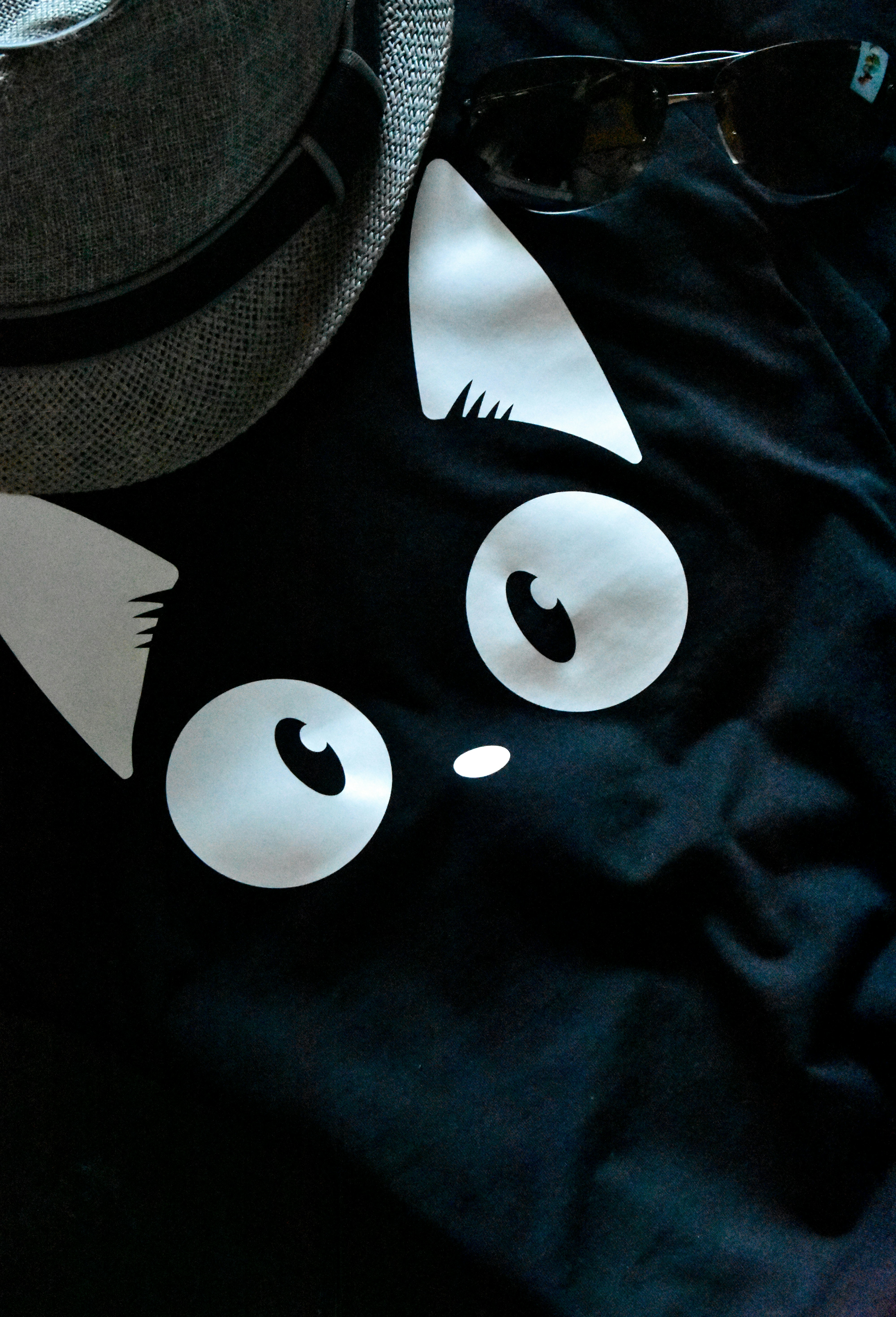 Whimsical Cat Gaze on a Dark Cotton Tee