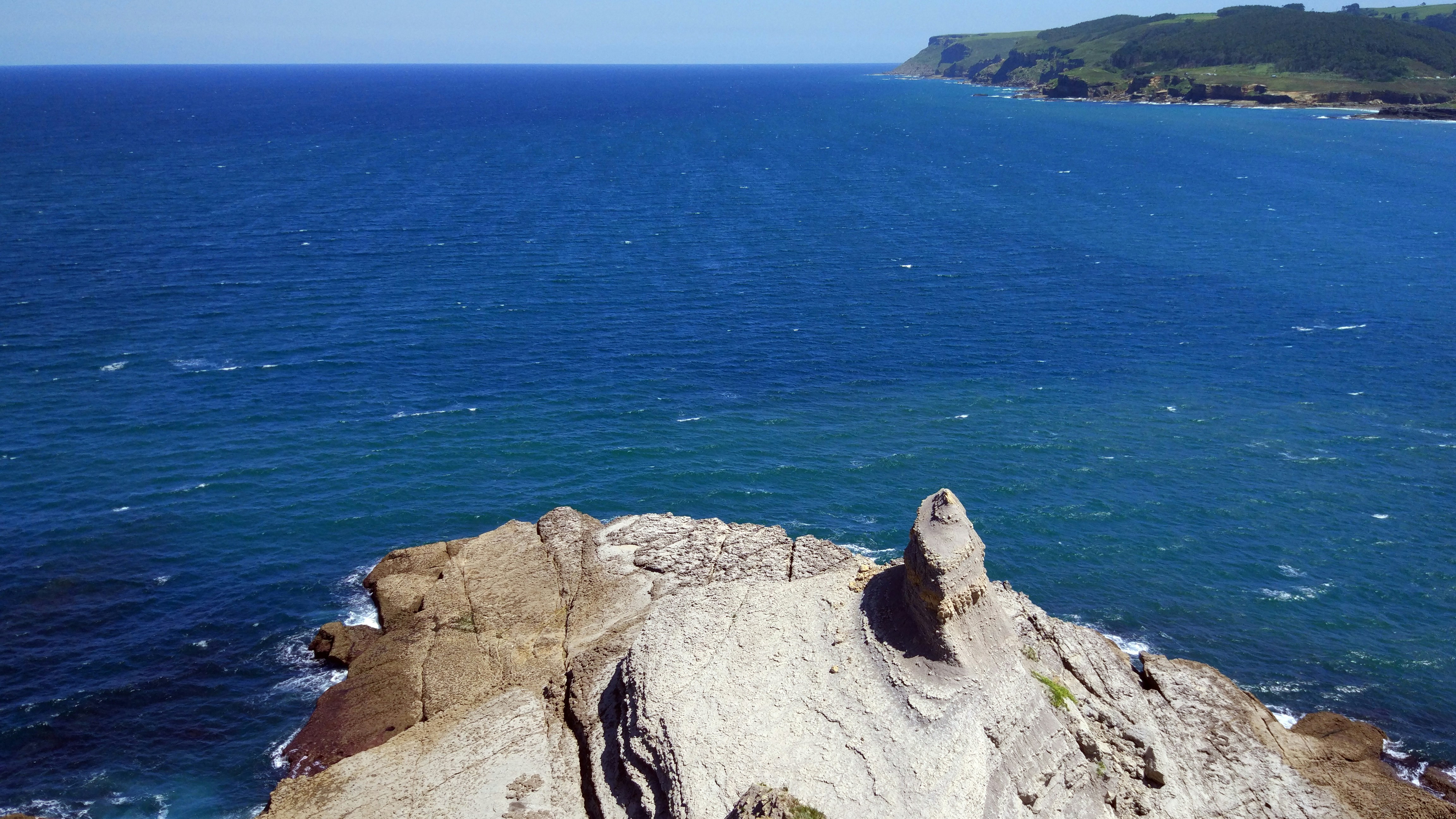 Edge of Blue: A rocky promontory guarding the endless sea