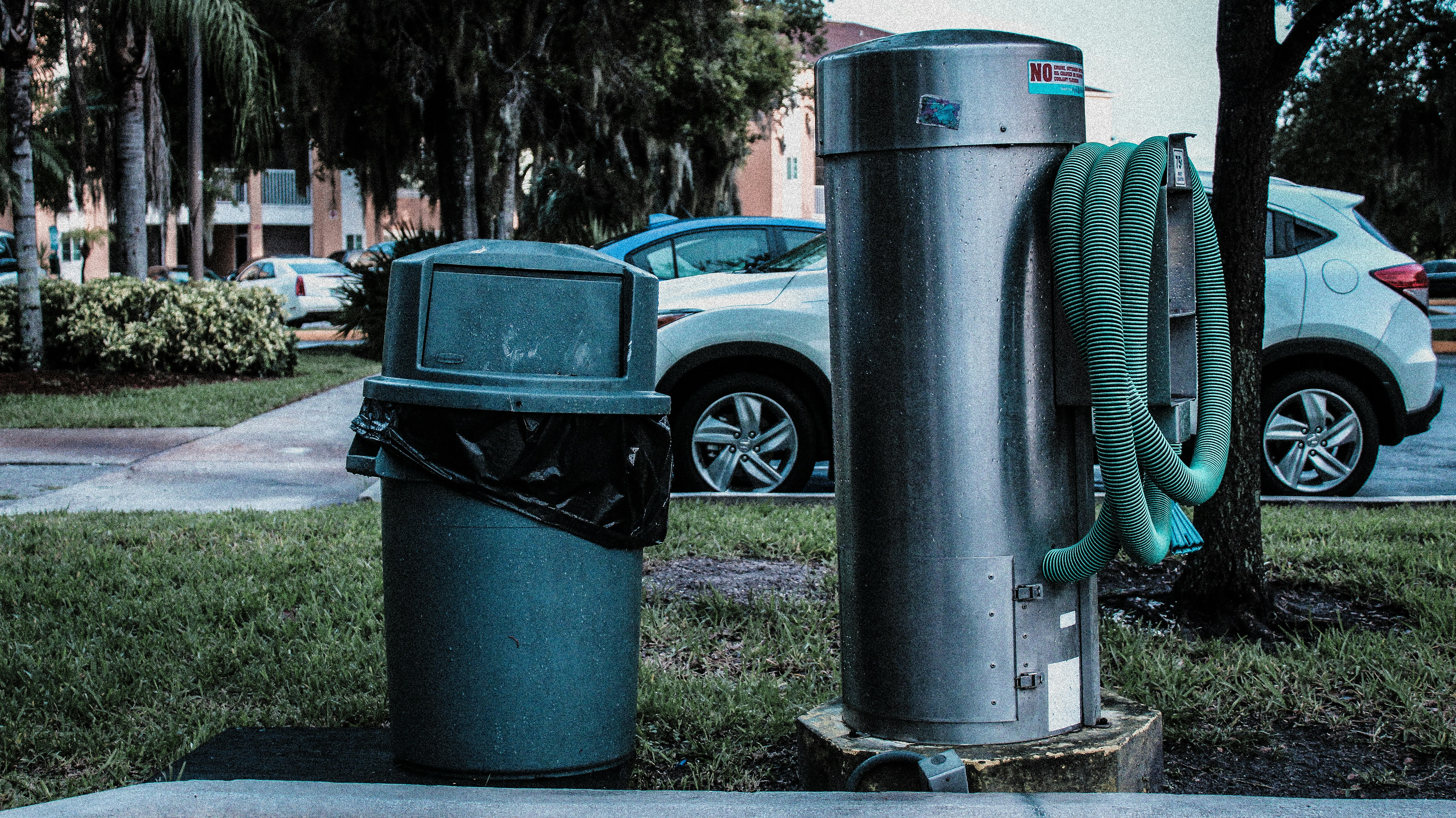 Garbage bin near cylinder gray machine on the street photo – Free Car ...