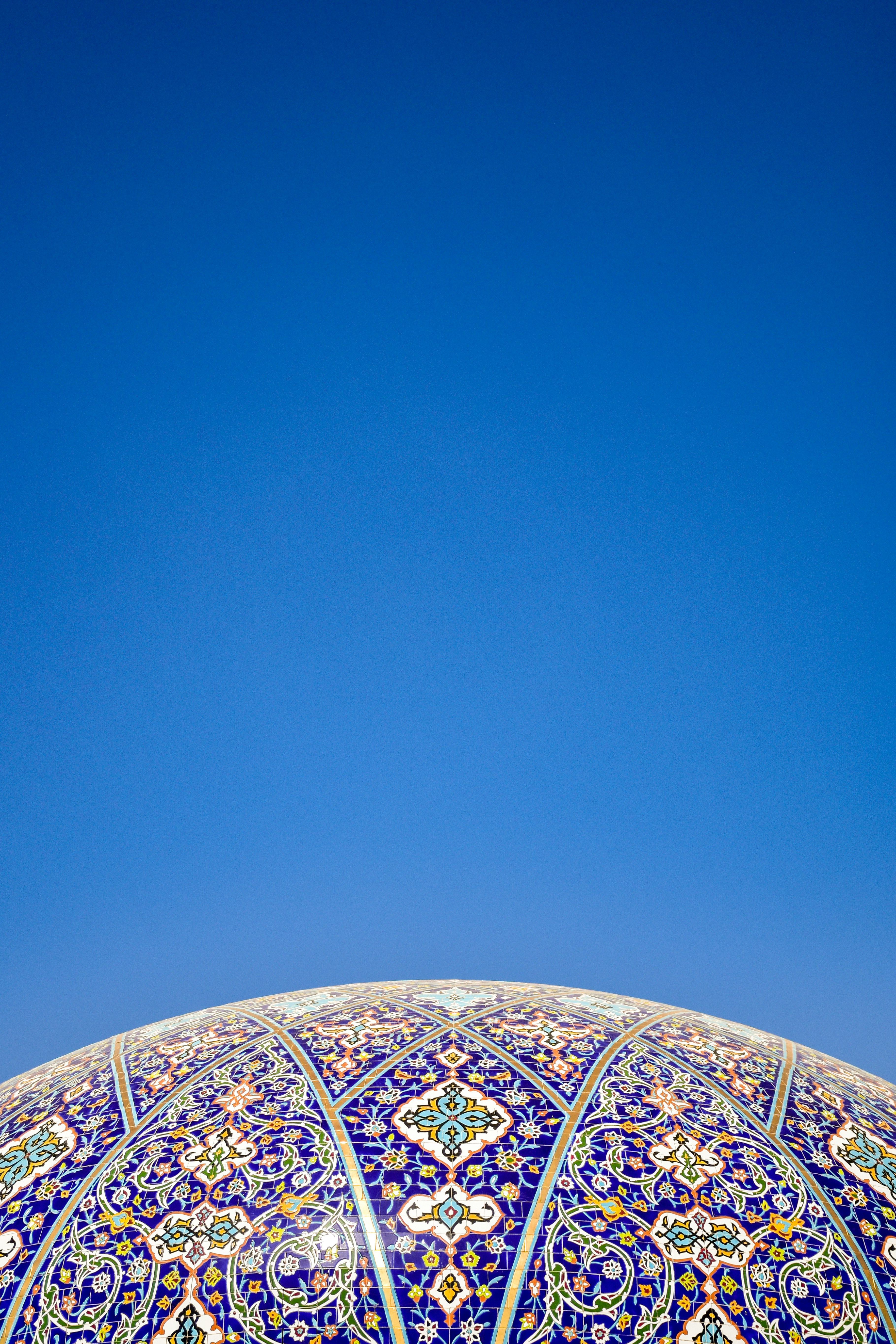  patterned dome under a vast blue sky