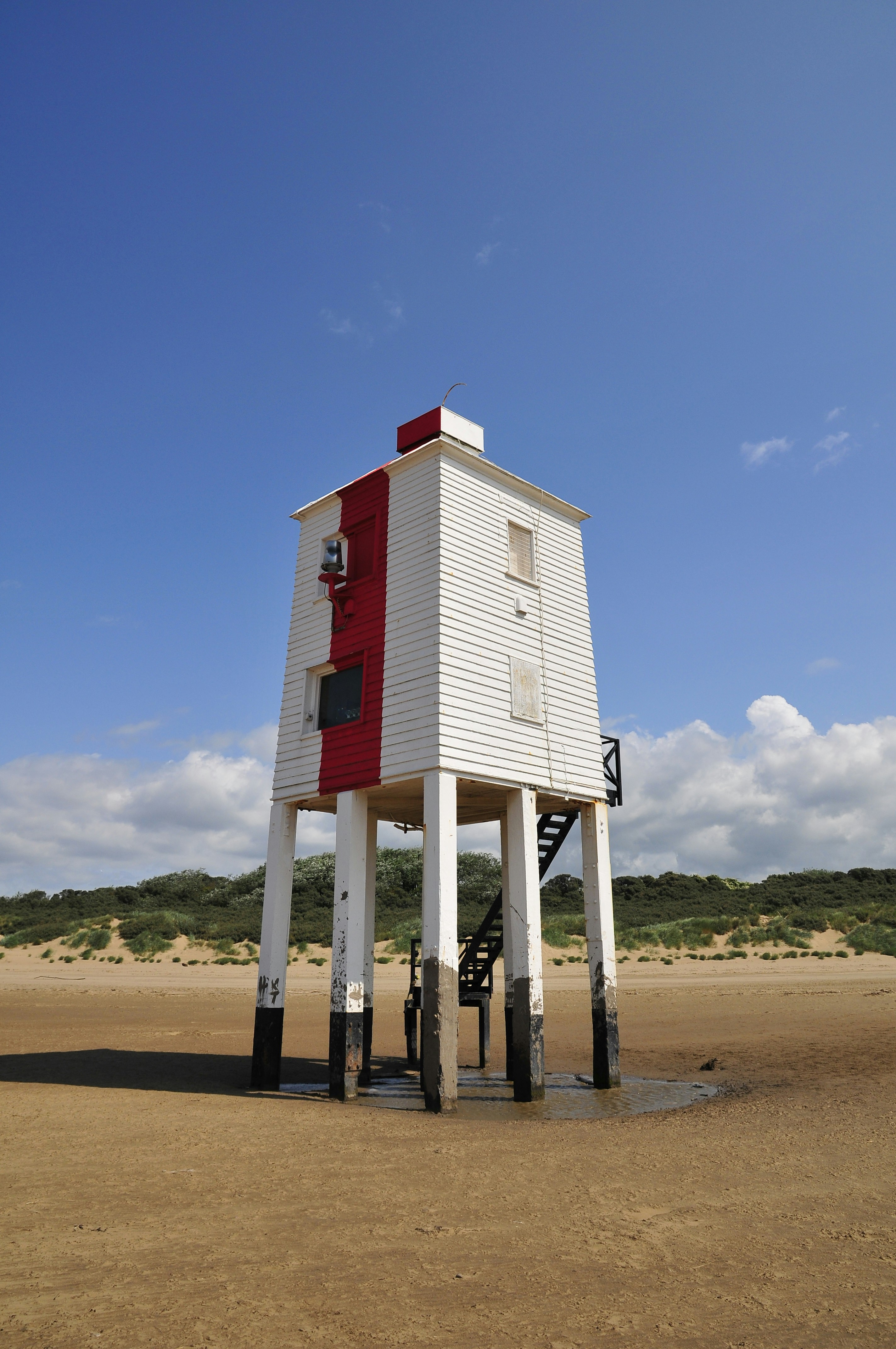 white and red building