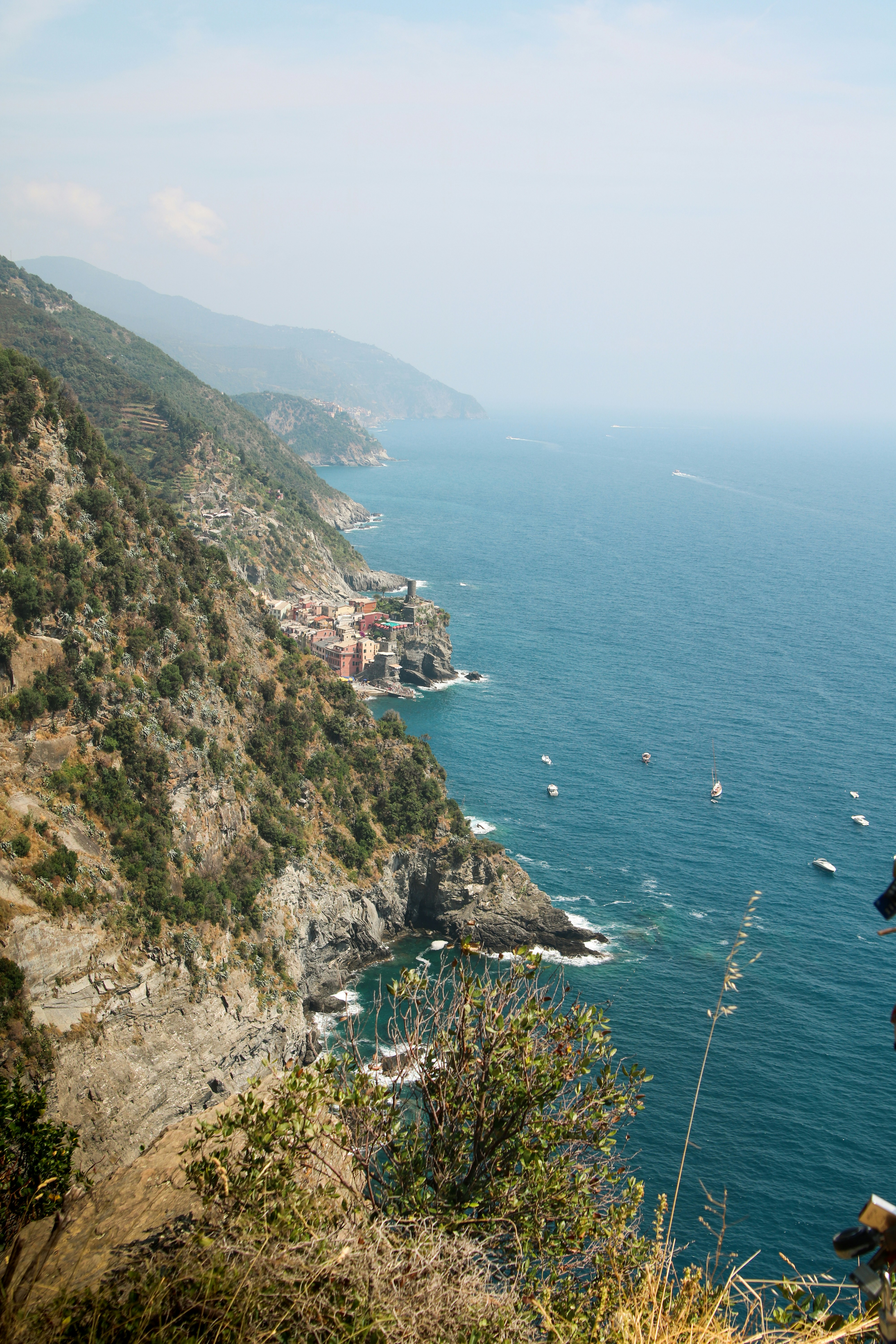 Sea beside mountain range under clear blue sky photo – Free Water Image ...