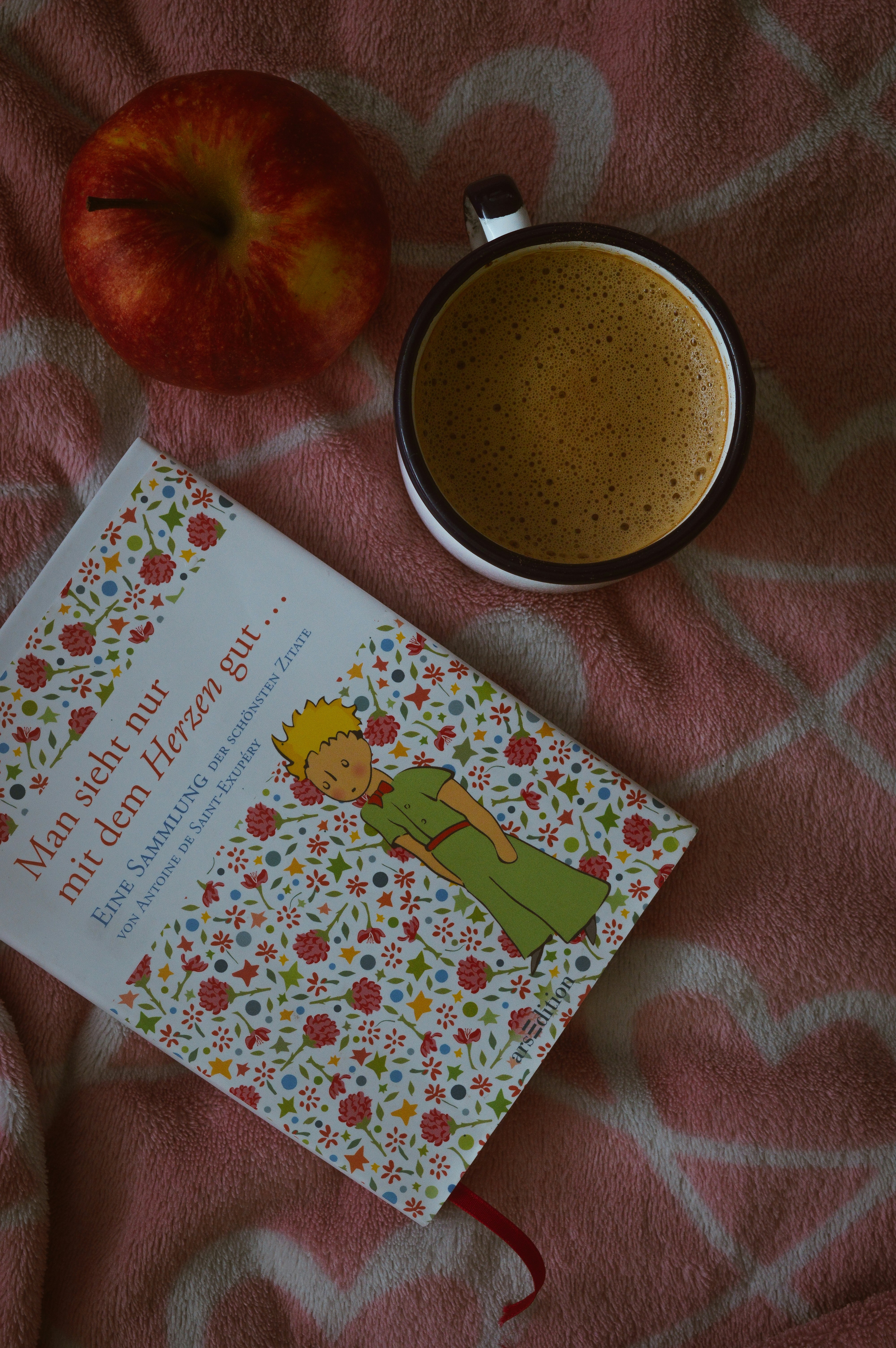 Morning Brew beside a Floral Page: Coffee, Apple, and Quiet Comfort