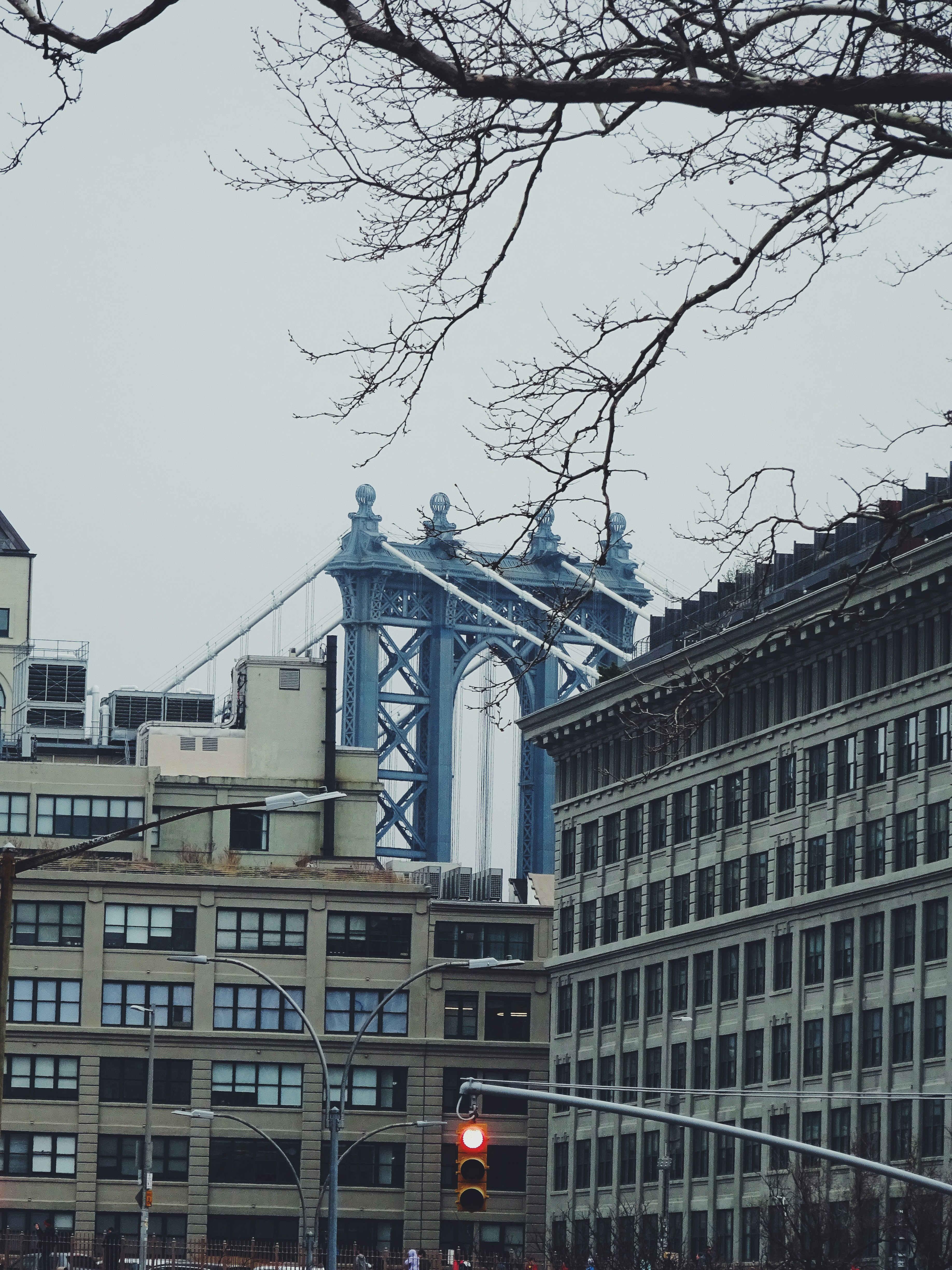 building near bridge during daytime