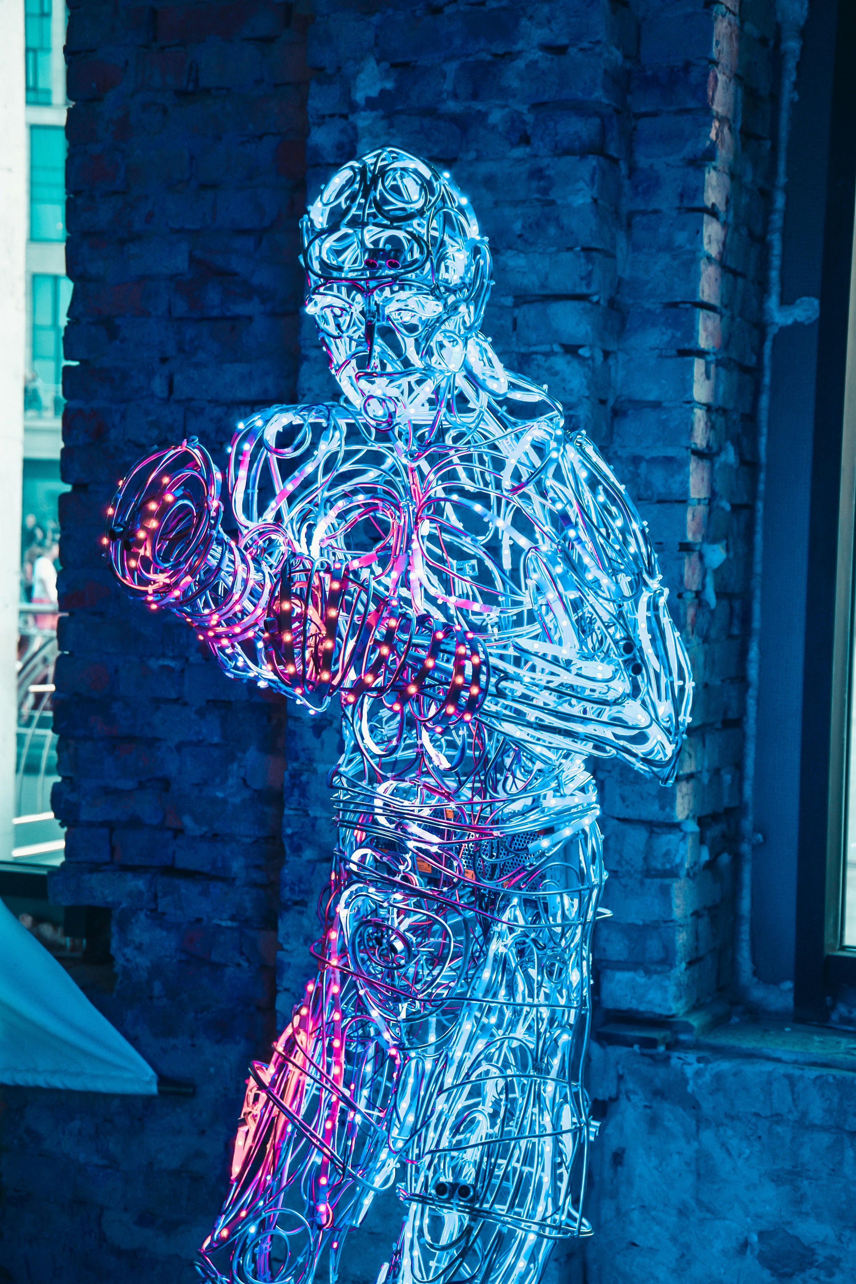 Neon Sentinel: A Figure of Light in a Stone Corridor