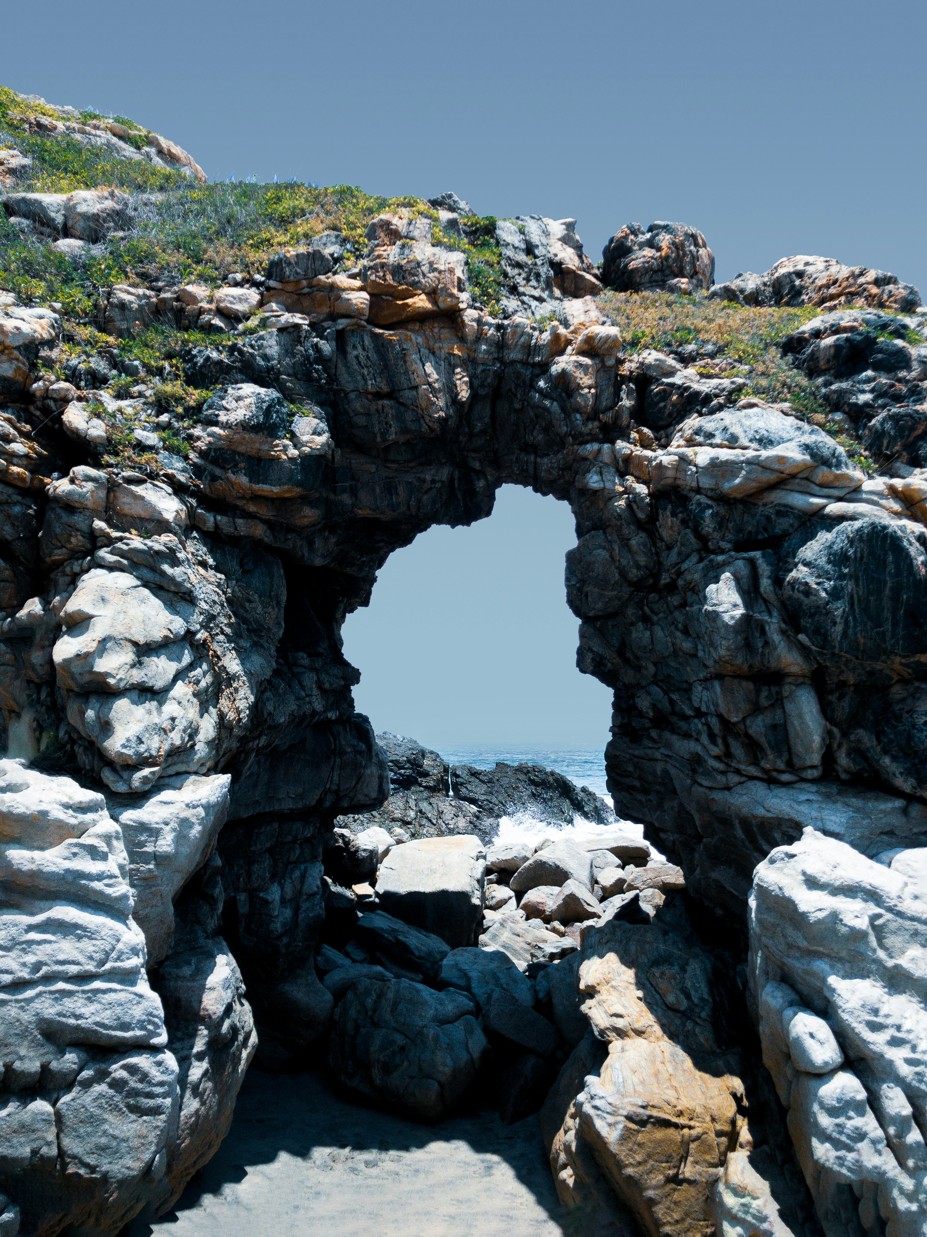 Sea Arch Framed by Weathered Granite